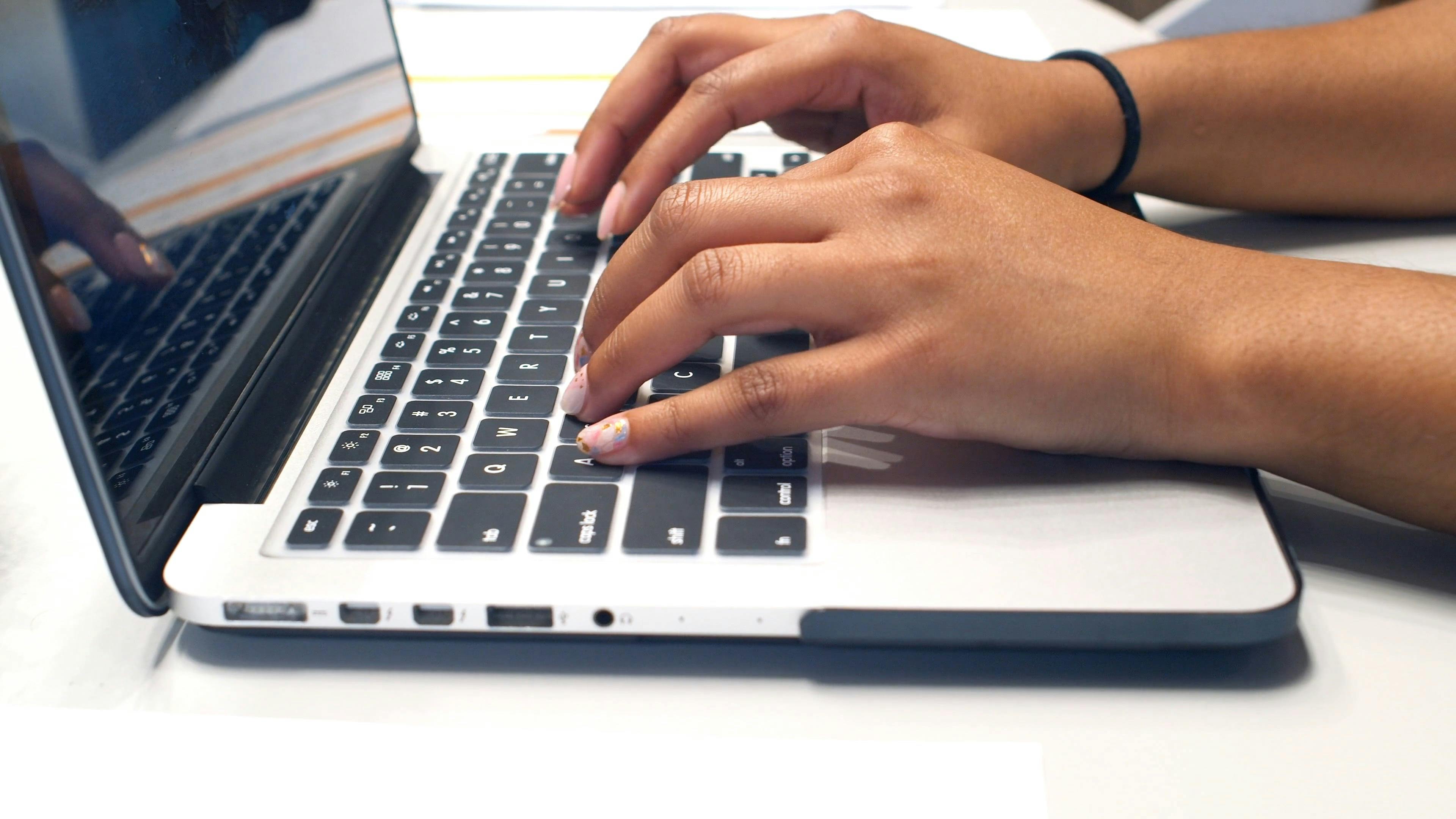 Person Typing on Computer · Free Stock Video