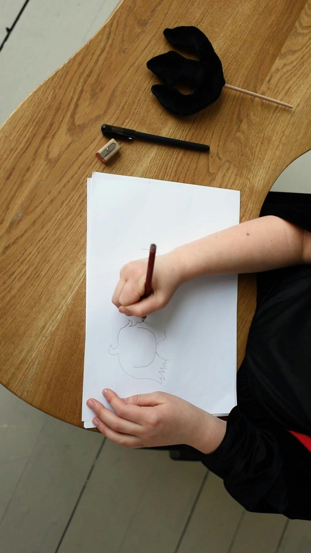 High Angle Shot of a Person Drawing on the Paper · Free Stock Video