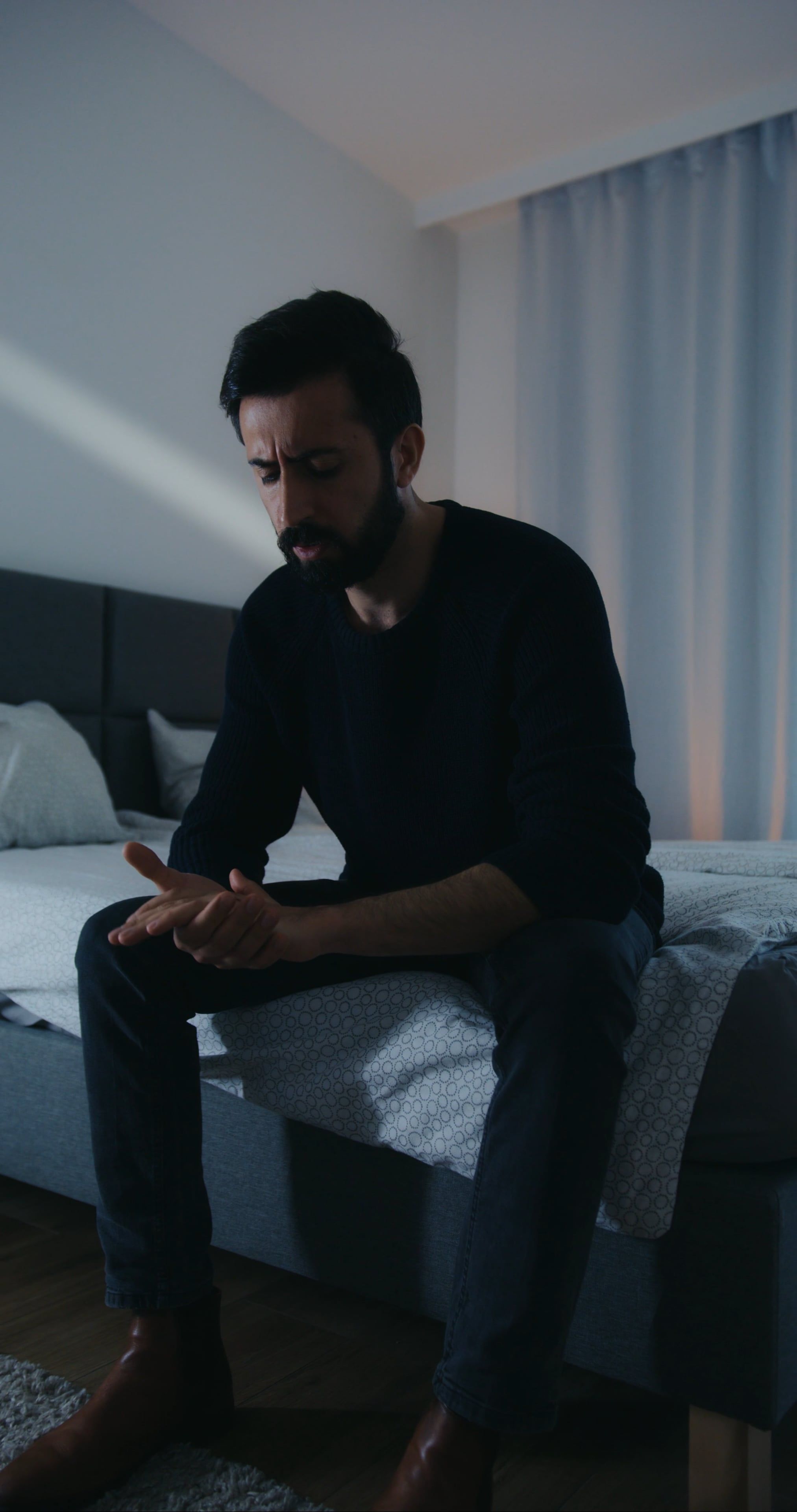 A Frustrated Man Sitting on the Bed · Free Stock Video