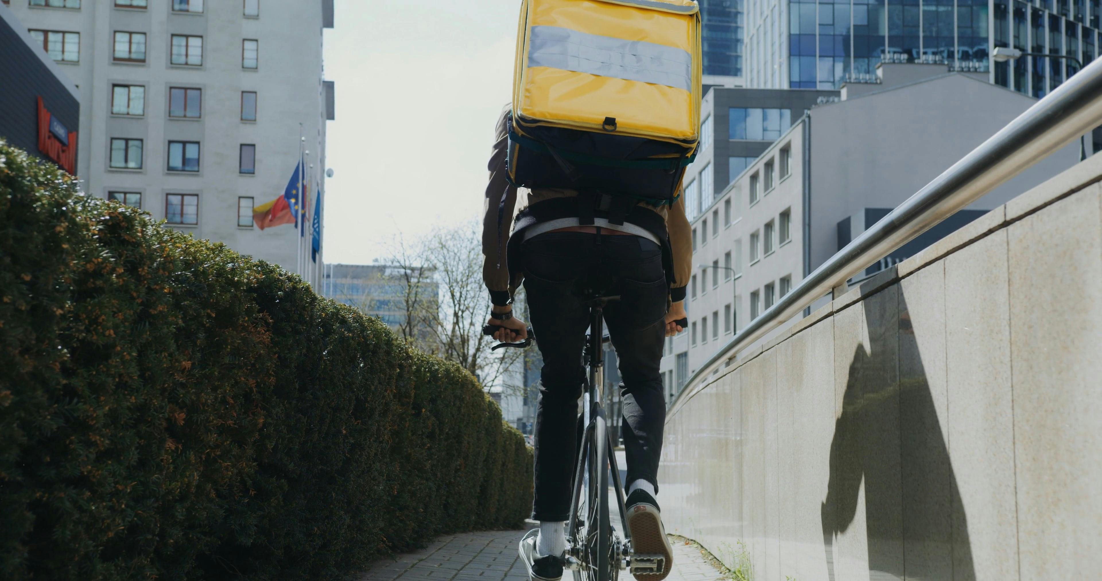 A Delivery Man Riding a Bike · Free Stock Video