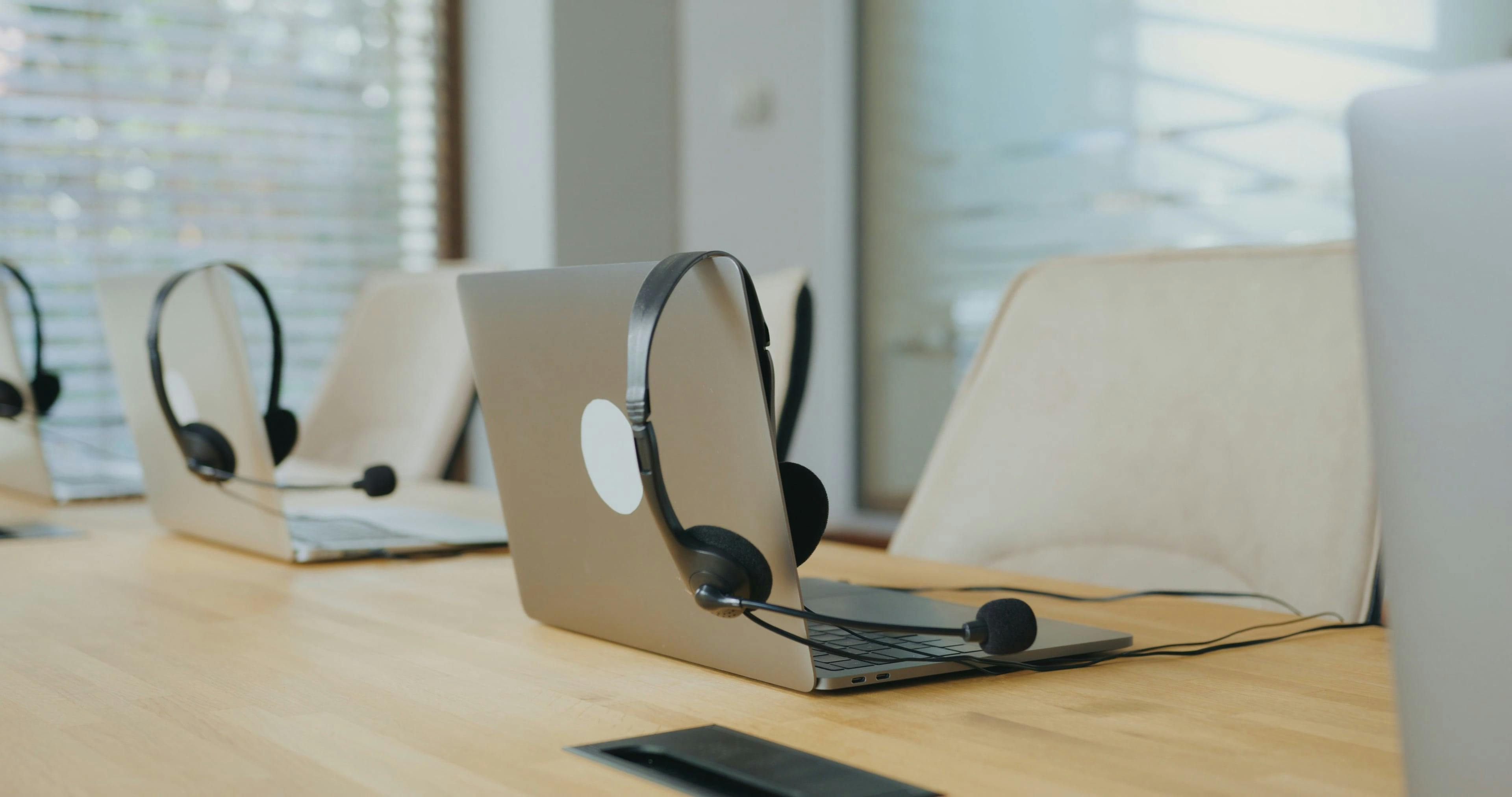 Laptops and Headsets on a Desk · Free Stock Video