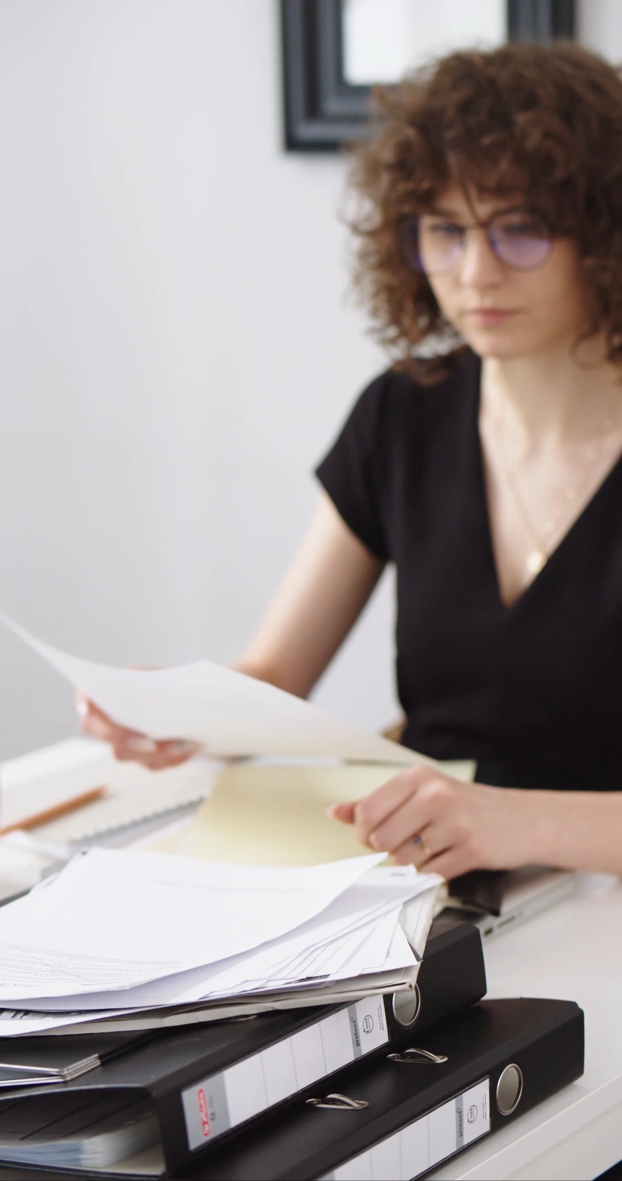 Woman Reading Through Paperwork · Free Stock Video
