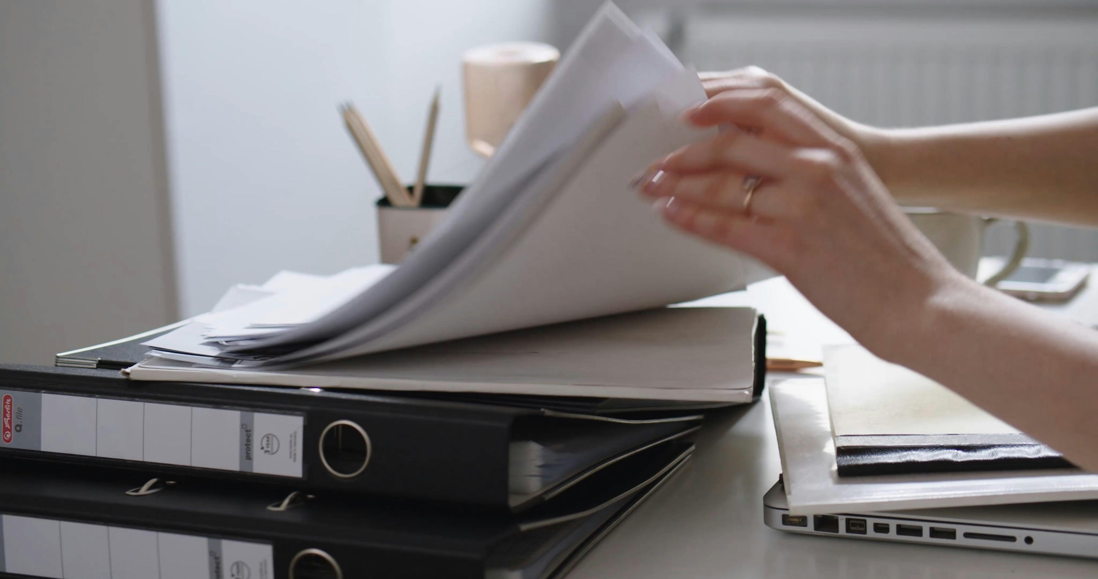 Person Looking Through Papers on Work Desk Free Stock Video Footage ...