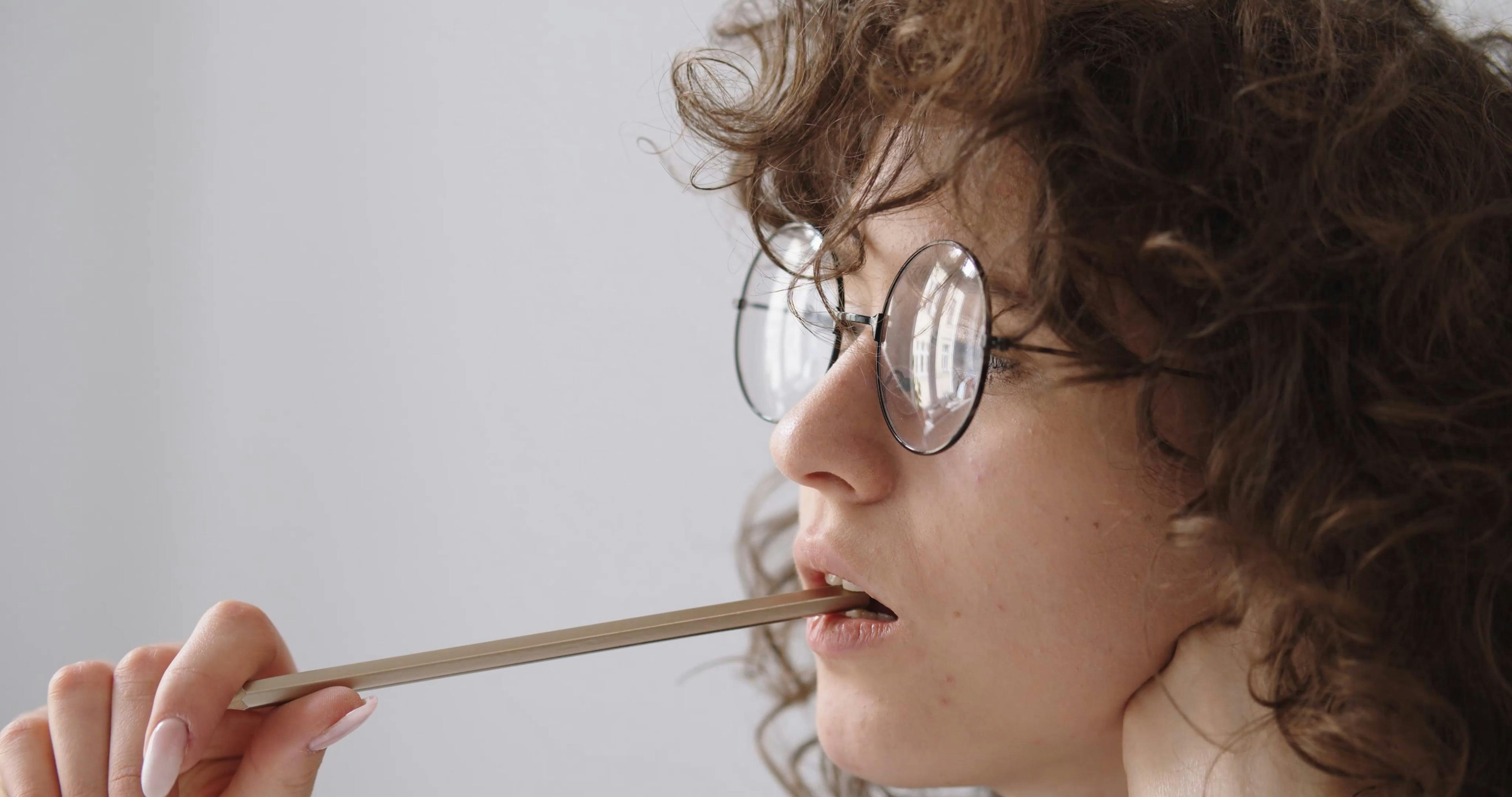 A Woman Biting a Pen Free Stock Video Footage, Royalty-Free 4K & HD ...