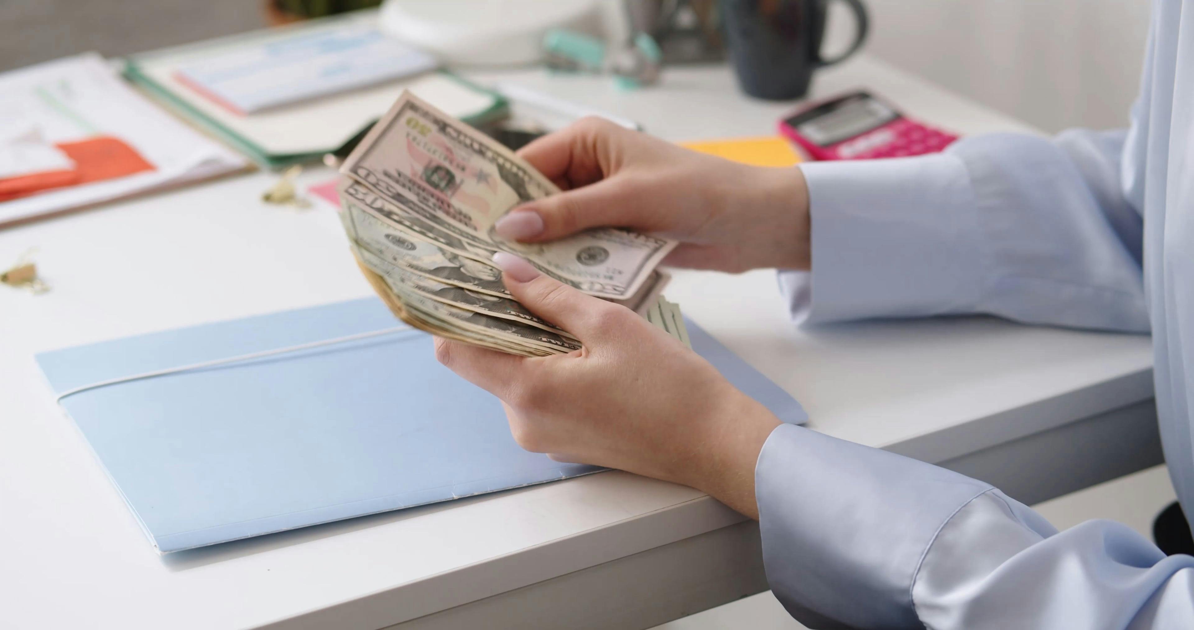 A Person Counting Her Money · Free Stock Video