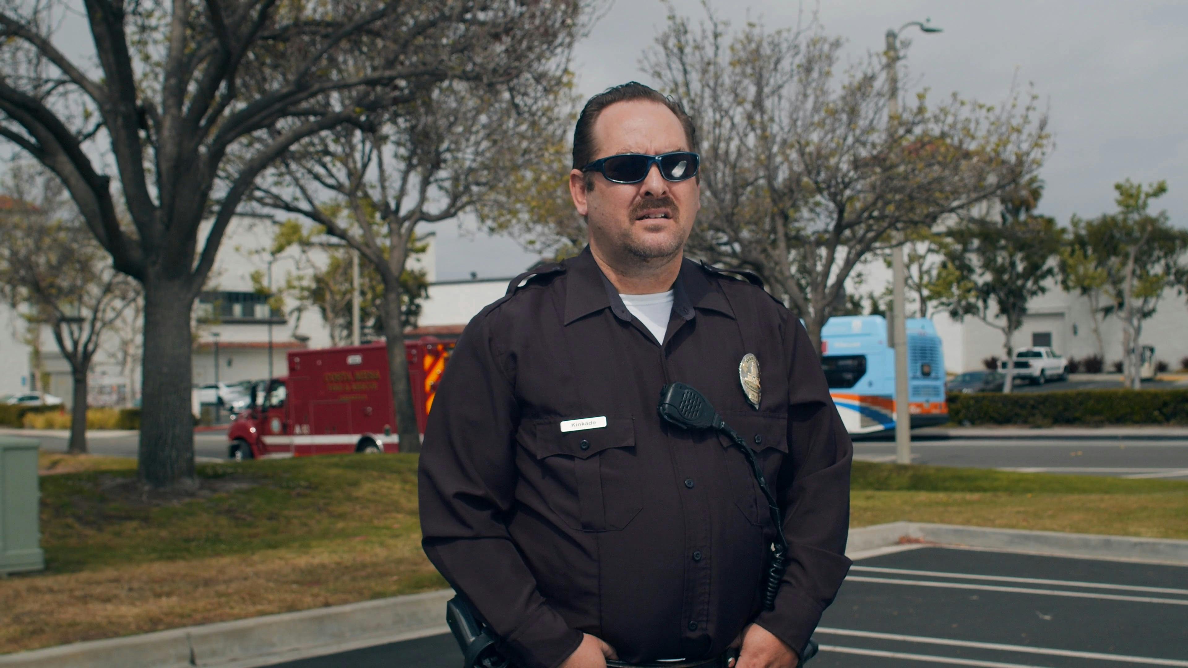A Male Police Officer Looking Around in Parking Lot Free Stock Video ...