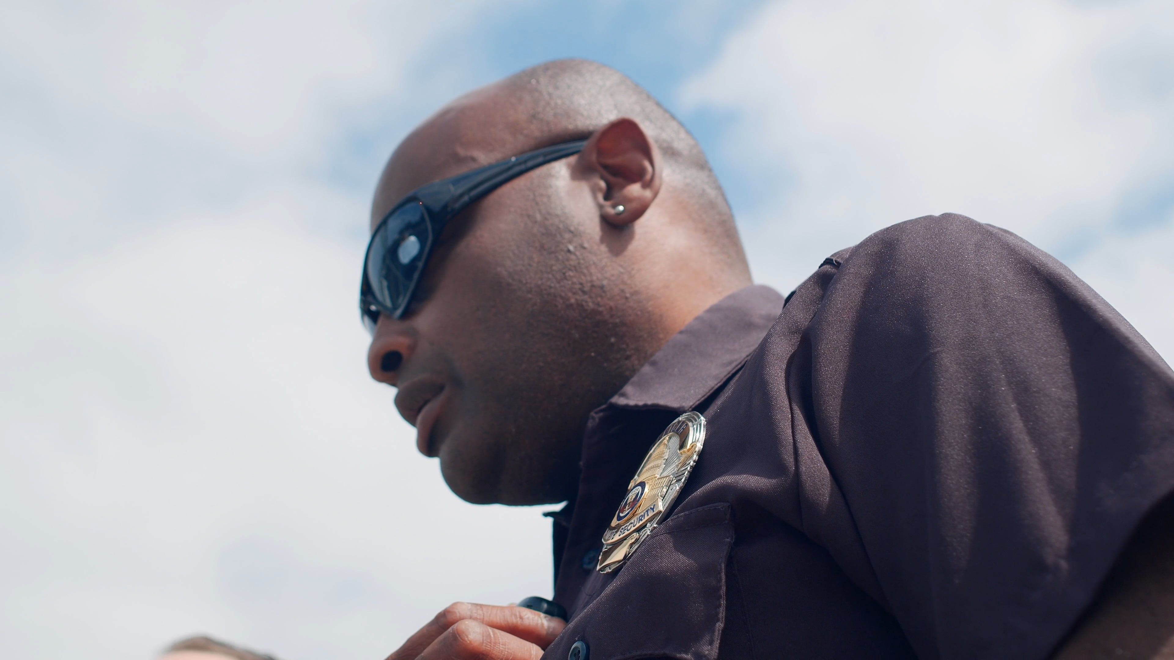 Low Angle Shot of Male Police Officers Talking to Each Other Free Stock ...