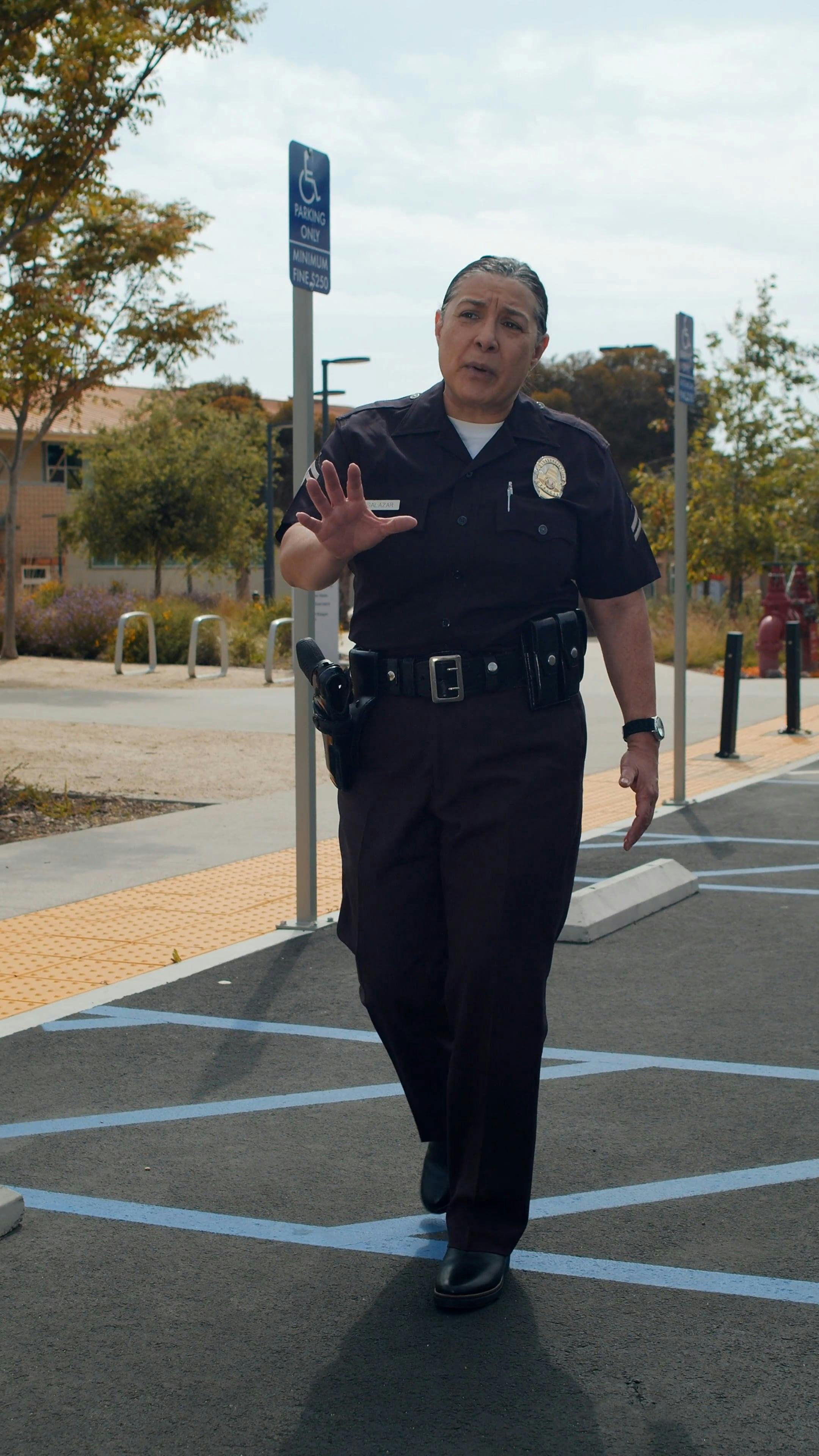 A Female Police Officer Talking and Doing Hand Gestures Free Stock ...