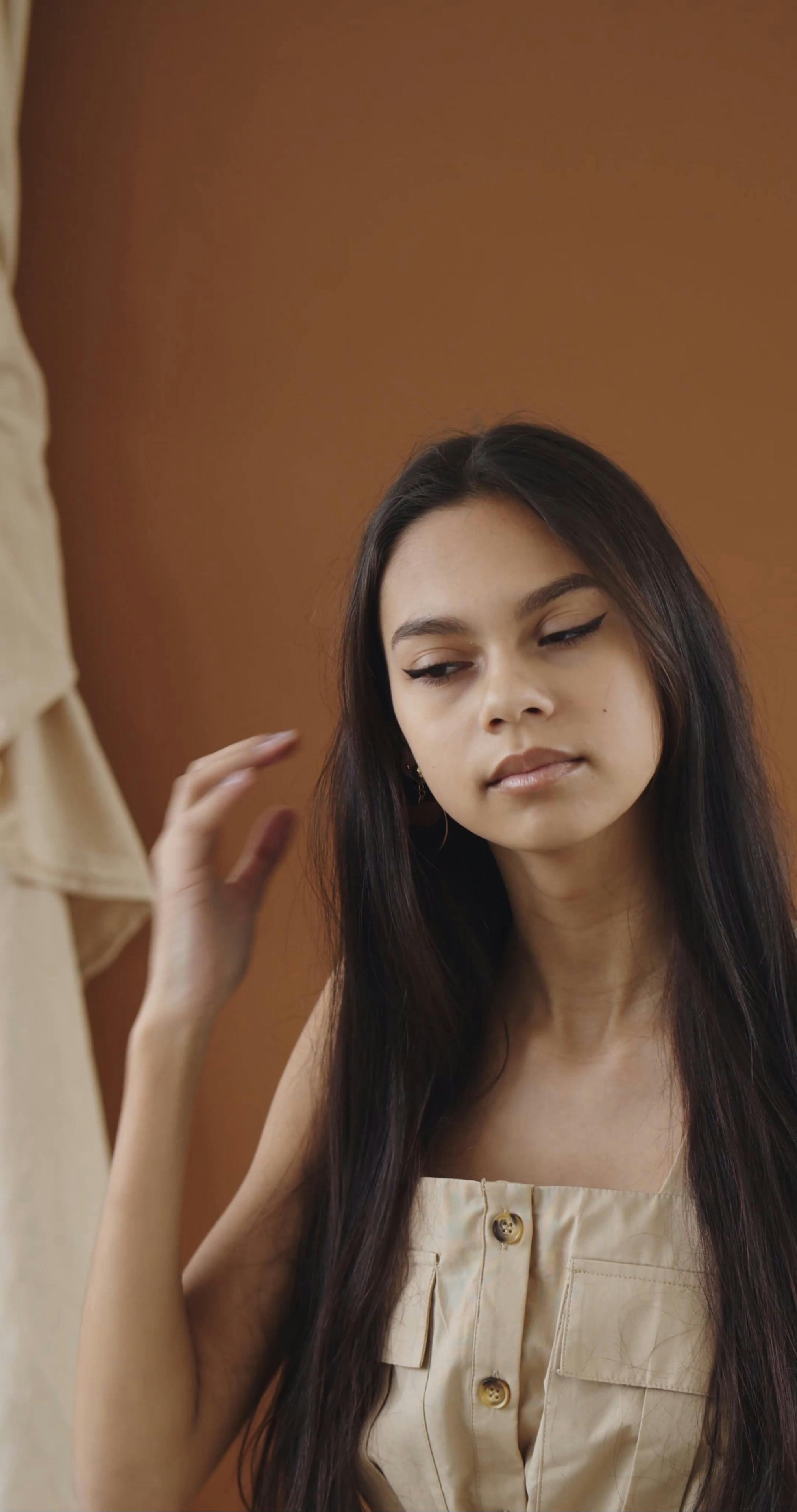 Young Woman Posing Fixing Hair · Free Stock Video