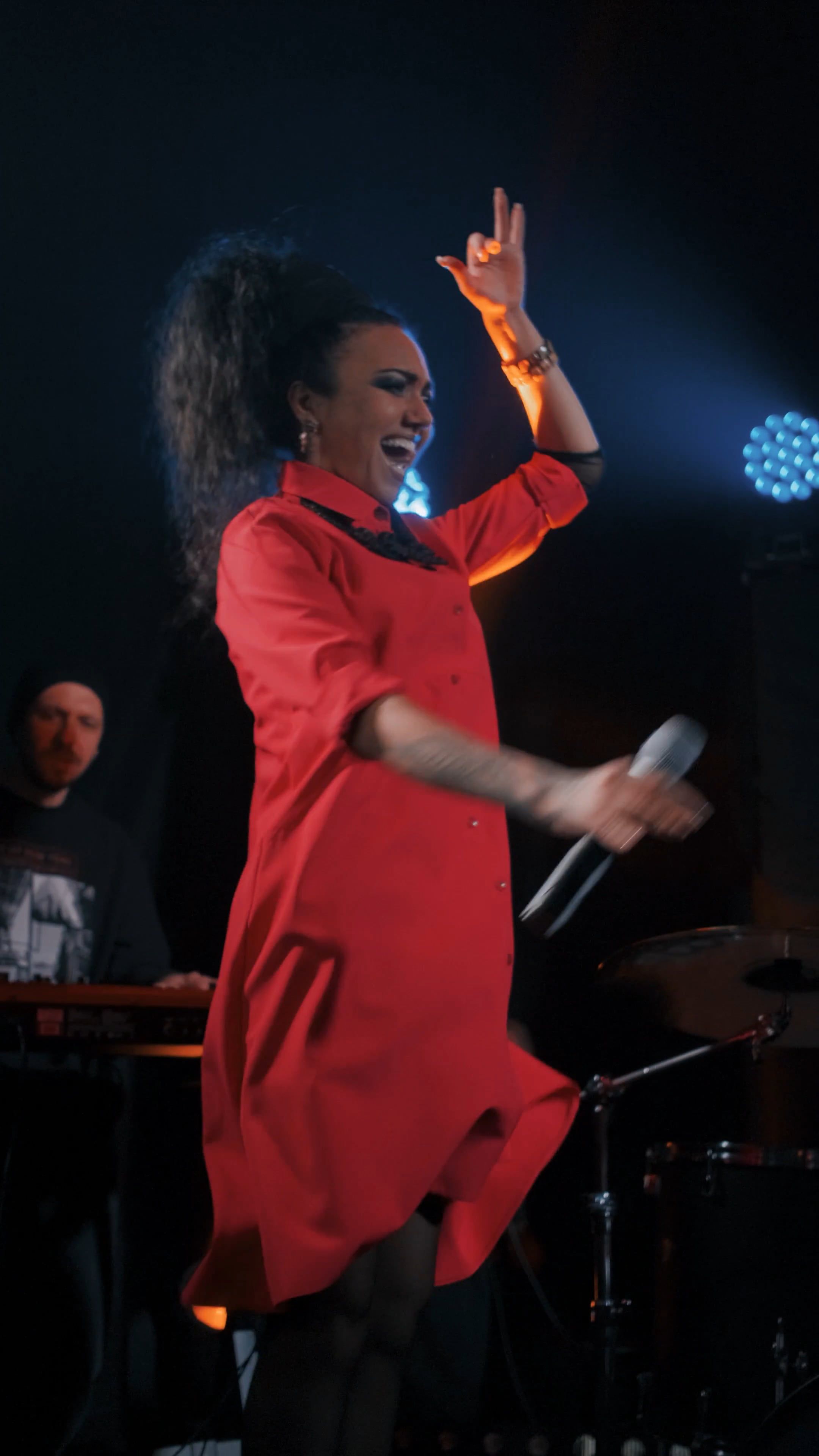 A Woman Singing and Performing · Free Stock Video
