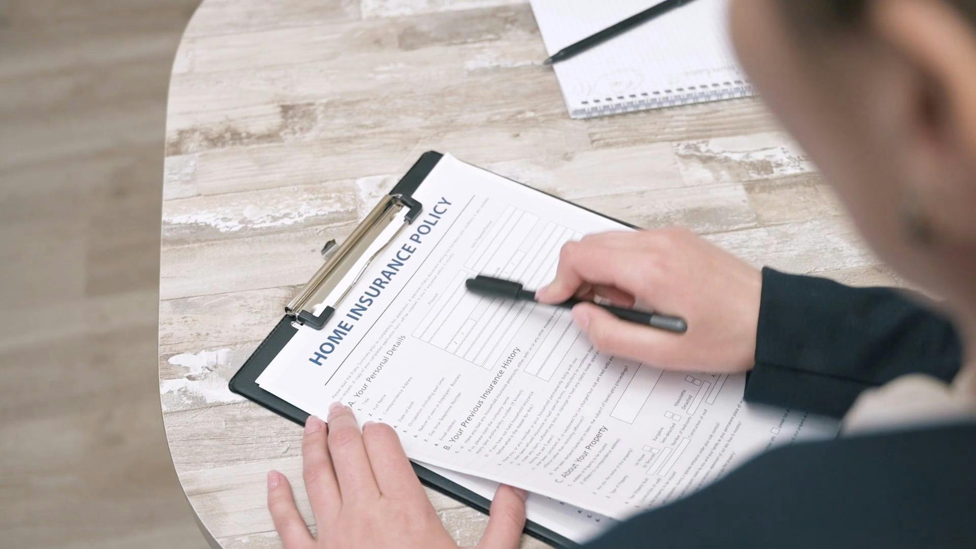 Explaining The Details Of A Home Insurance Policy Free Stock Video ...