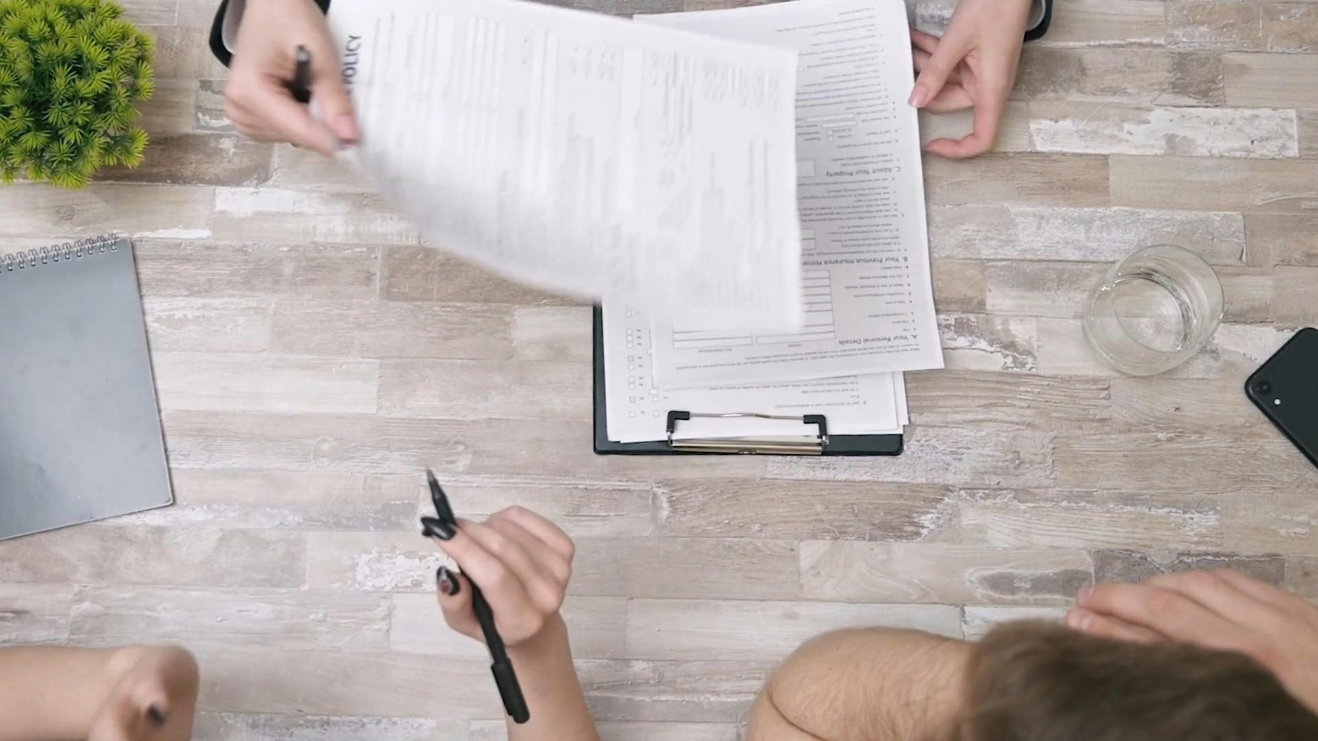 A Person Giving Documents to a Couple Free Stock Video Footage, Royalty ...