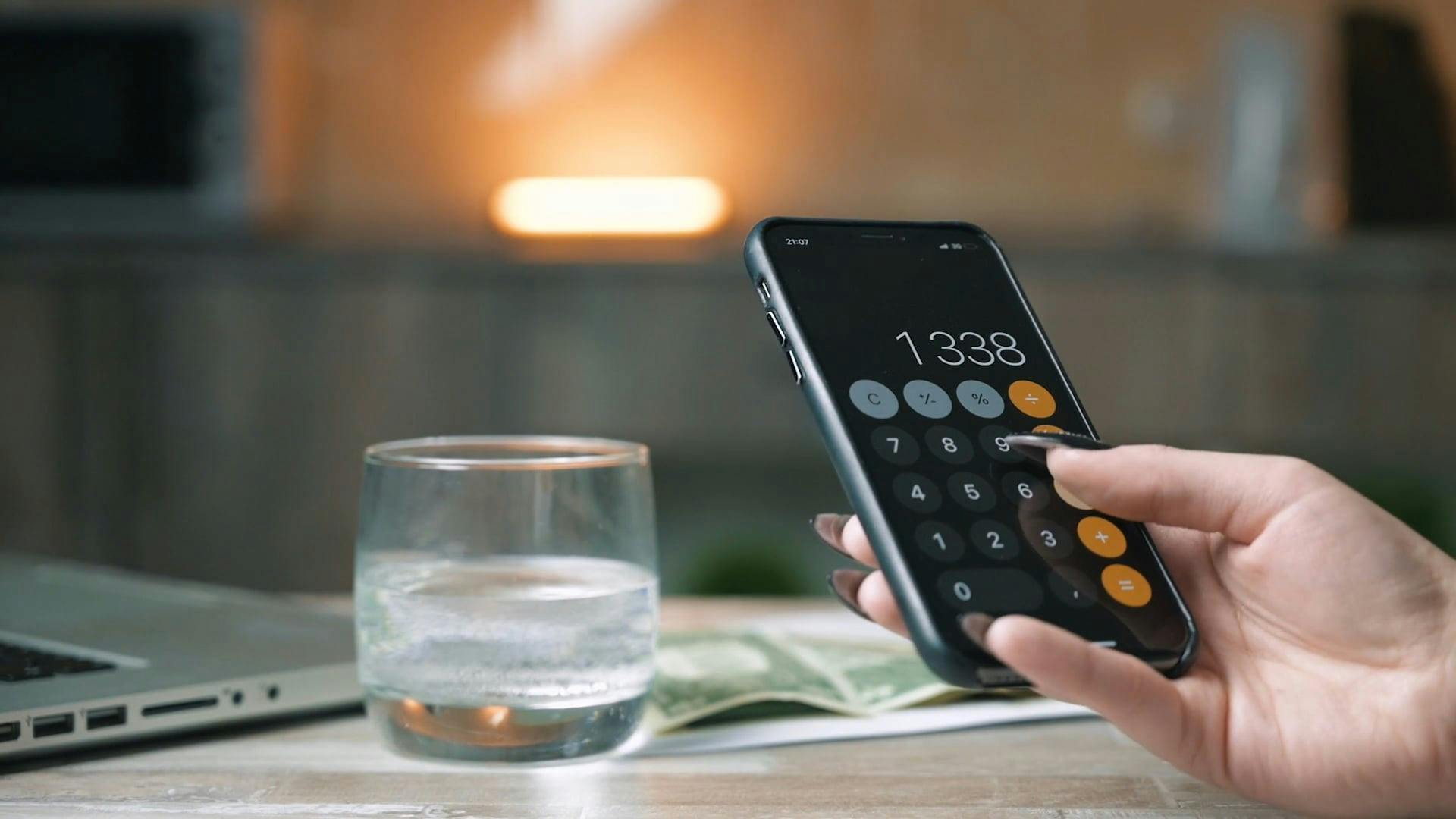 A Person Calculating using Smartphone · Free Stock Video