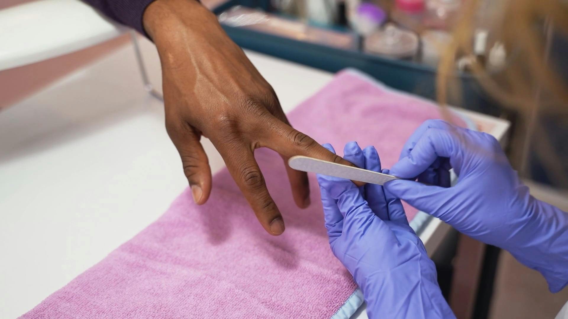Manicurist Scrubbing the Nails with Nail File Free Stock Video Footage ...