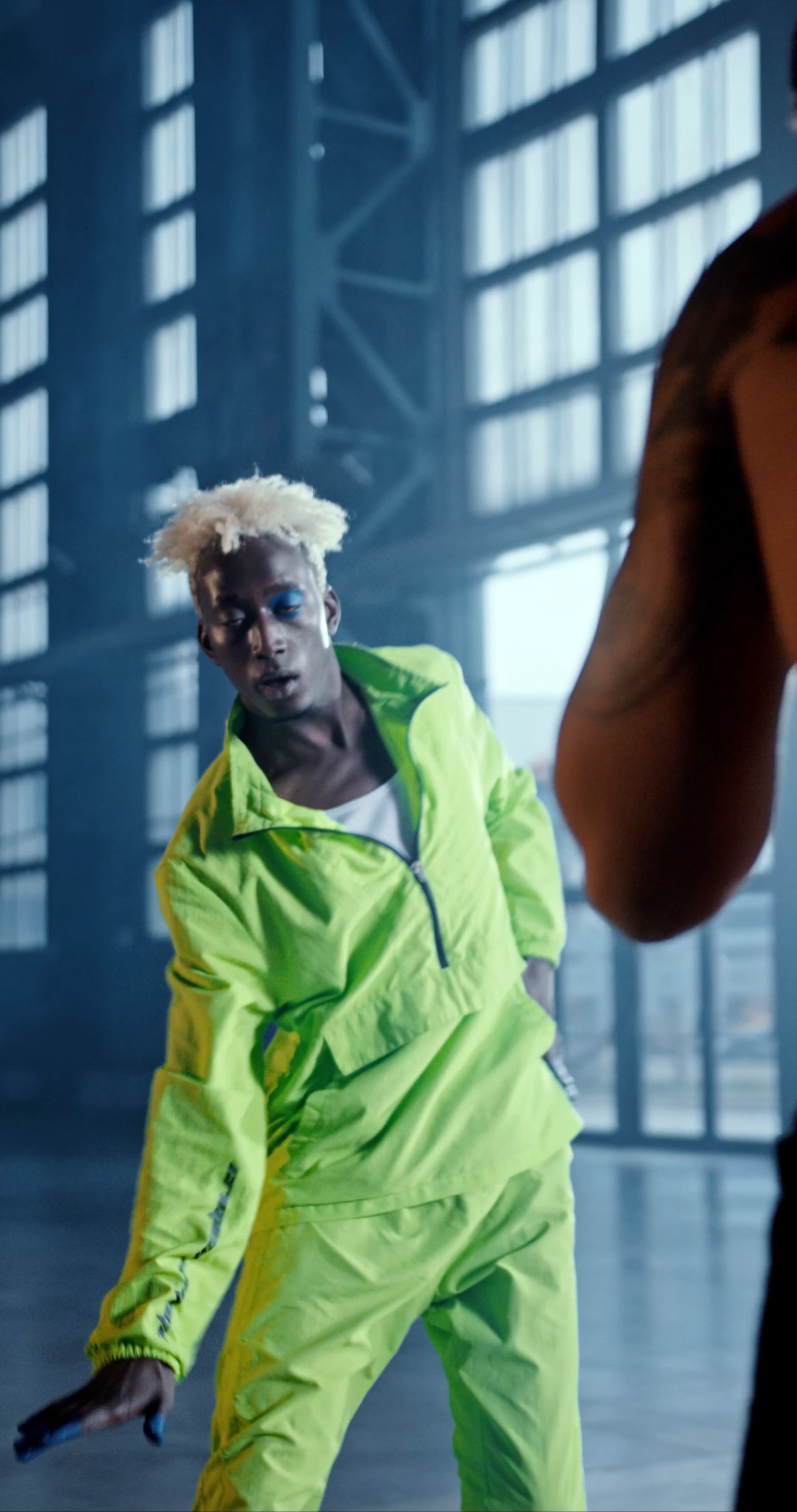 A Man Doing Dance Moves while Wearing Neon Clothes Free Stock Video ...
