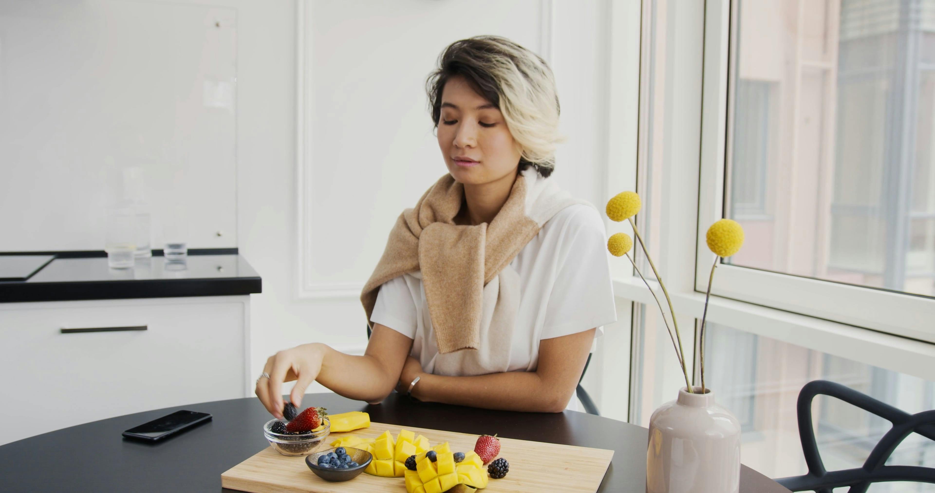 Woman Eating Fruits While Poses On Camera Free Stock Video Footage ...