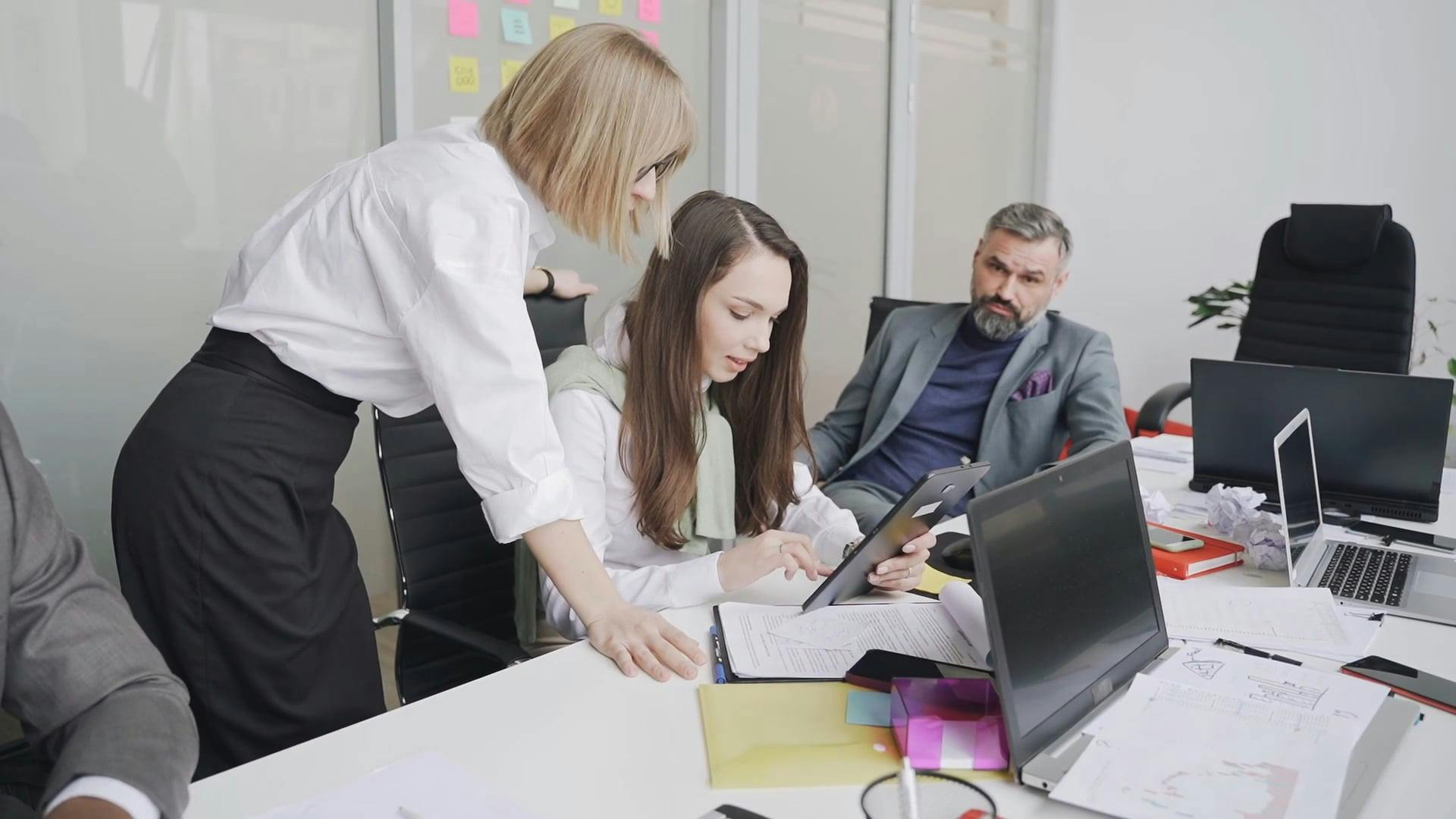 Employees Researching using the Tablet while Talking to her Boss Free ...