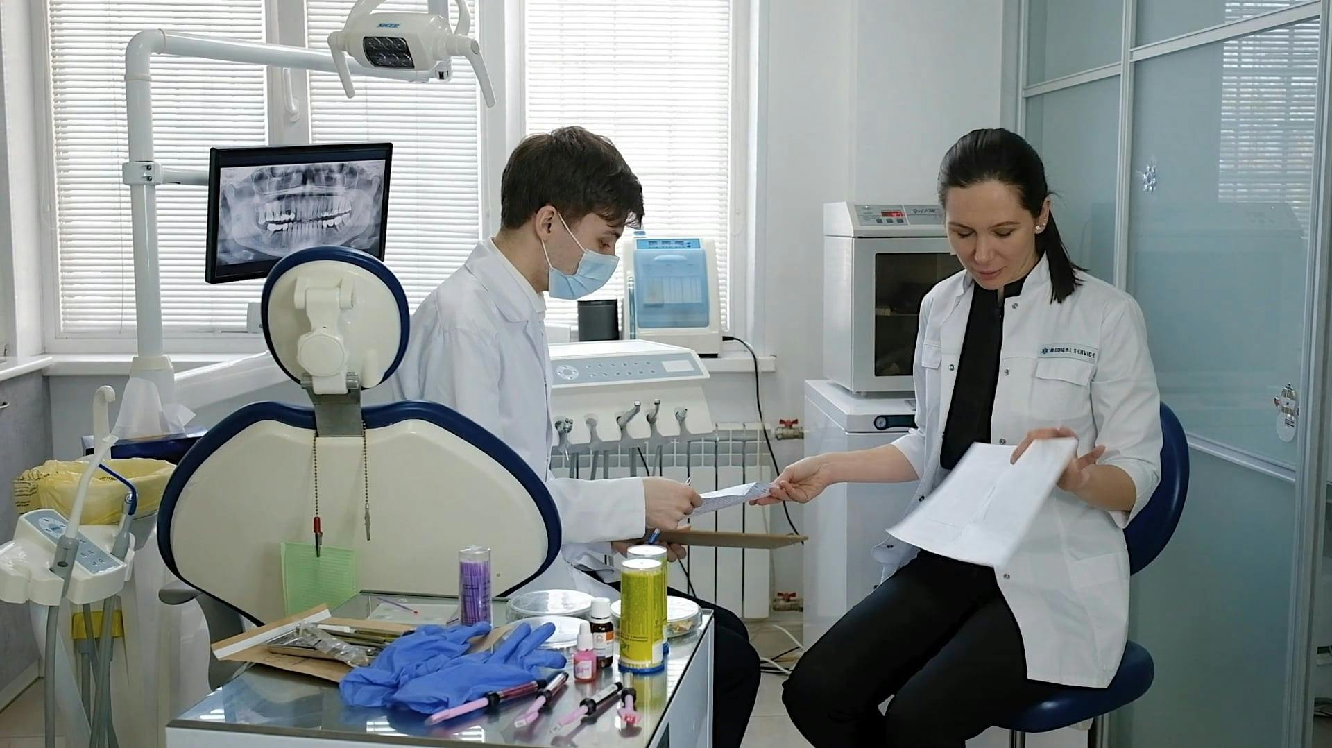 A Dentist Evaluating a Trainee Dental Nurse Free Stock Video Footage ...