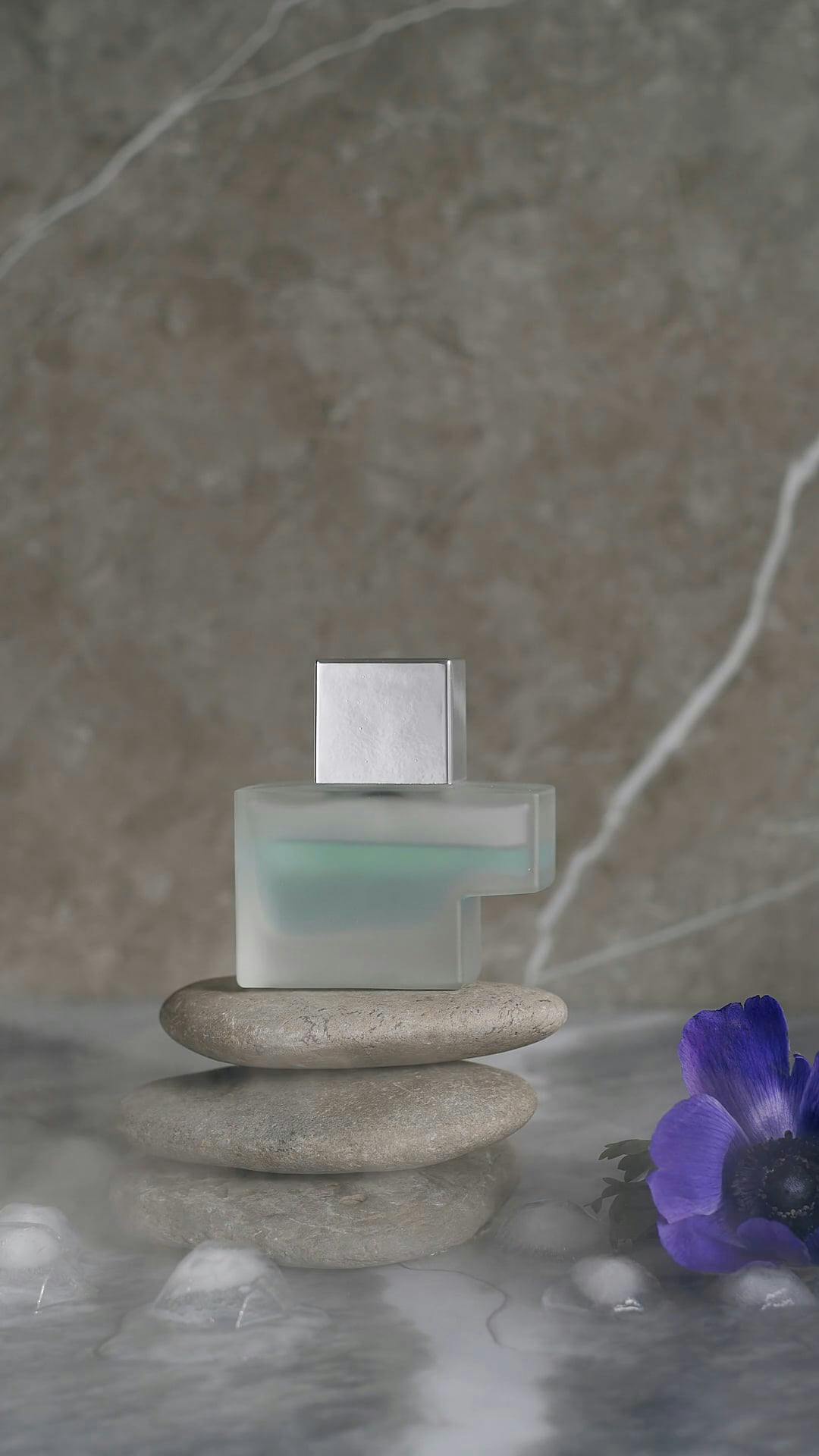 Perfume Bottle On Top of a Stone · Free Stock Video