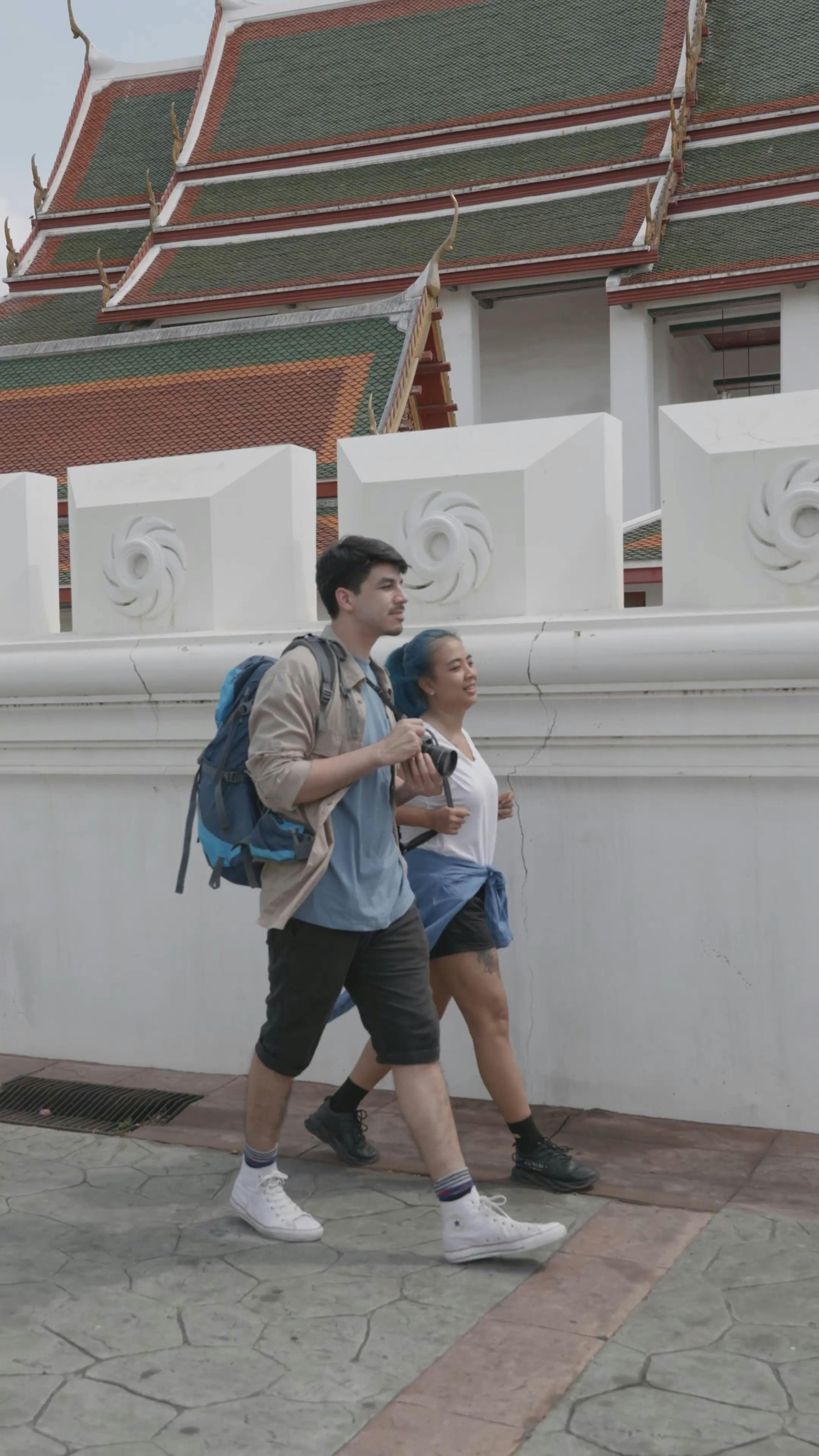People Carrying Backpacks Walking Together · Free Stock Video