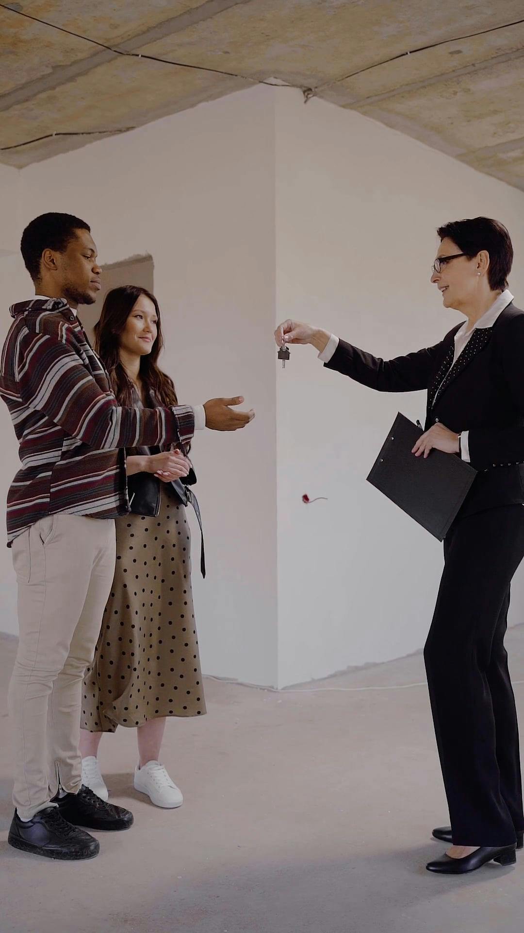 A Realtor Handing Over the House Key · Free Stock Video