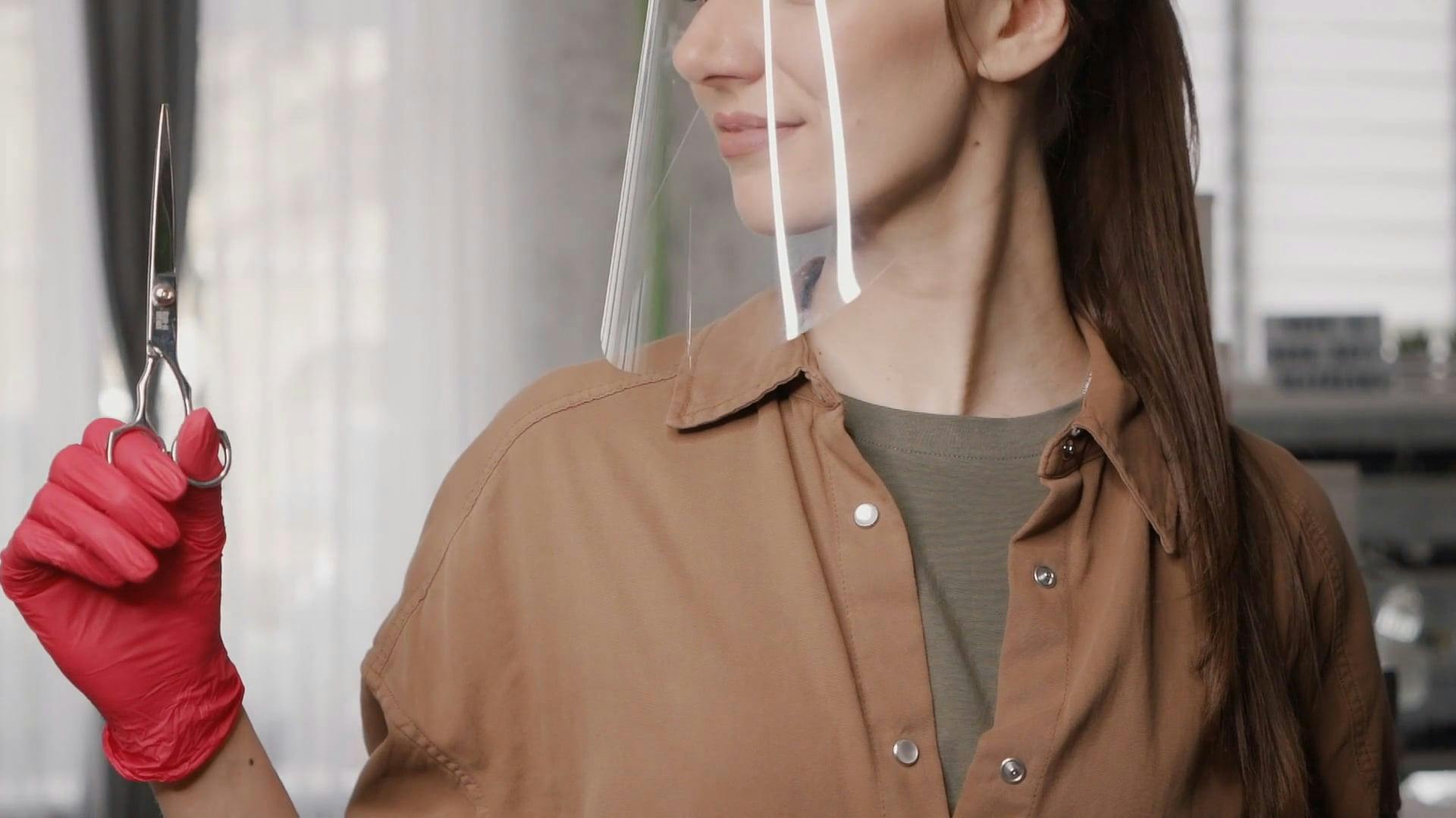 Woman Holding Scissors Looking at Camera · Free Stock Video