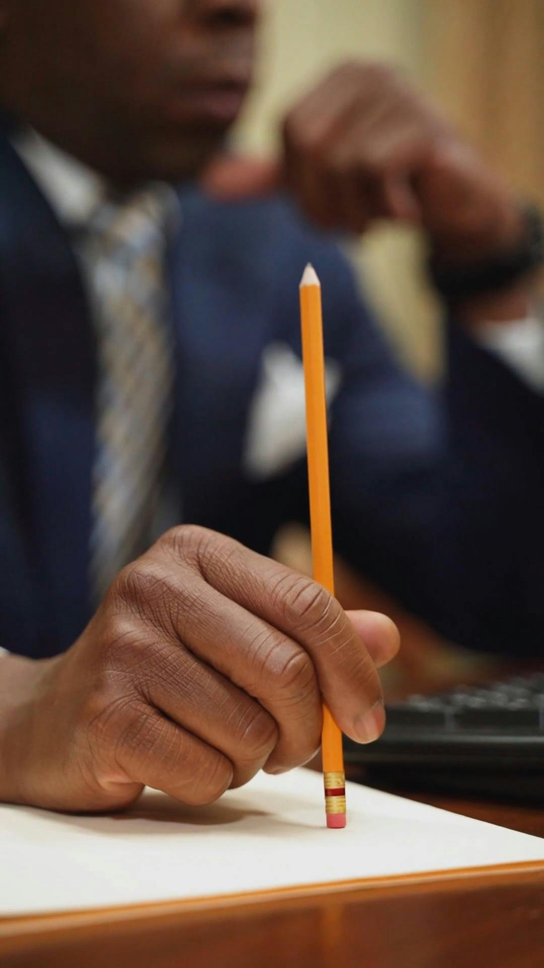 A Man Holding a Pencil at the Office · Free Stock Video