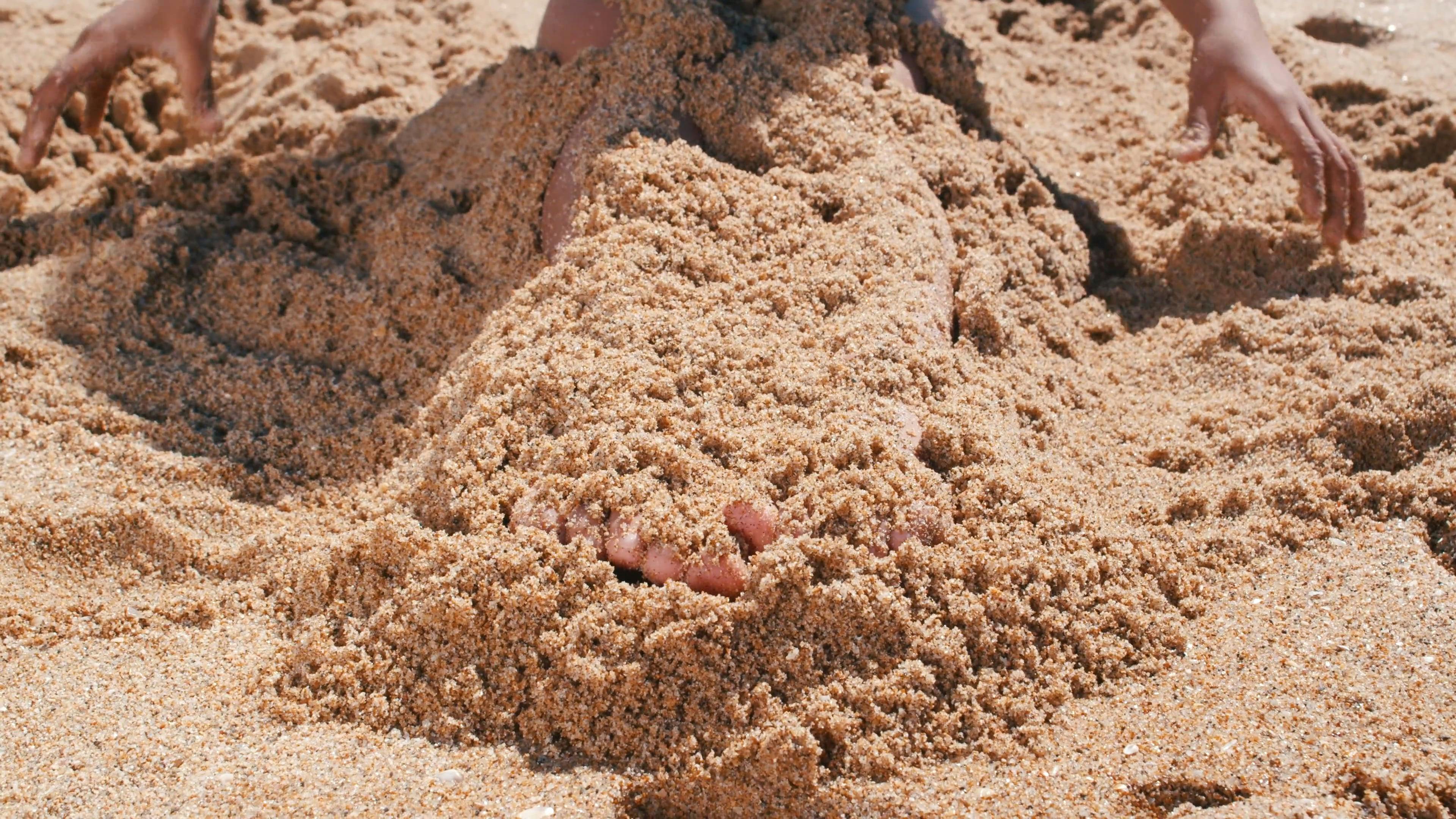 Girl Covering Her Legs With Sand · Free Stock Video