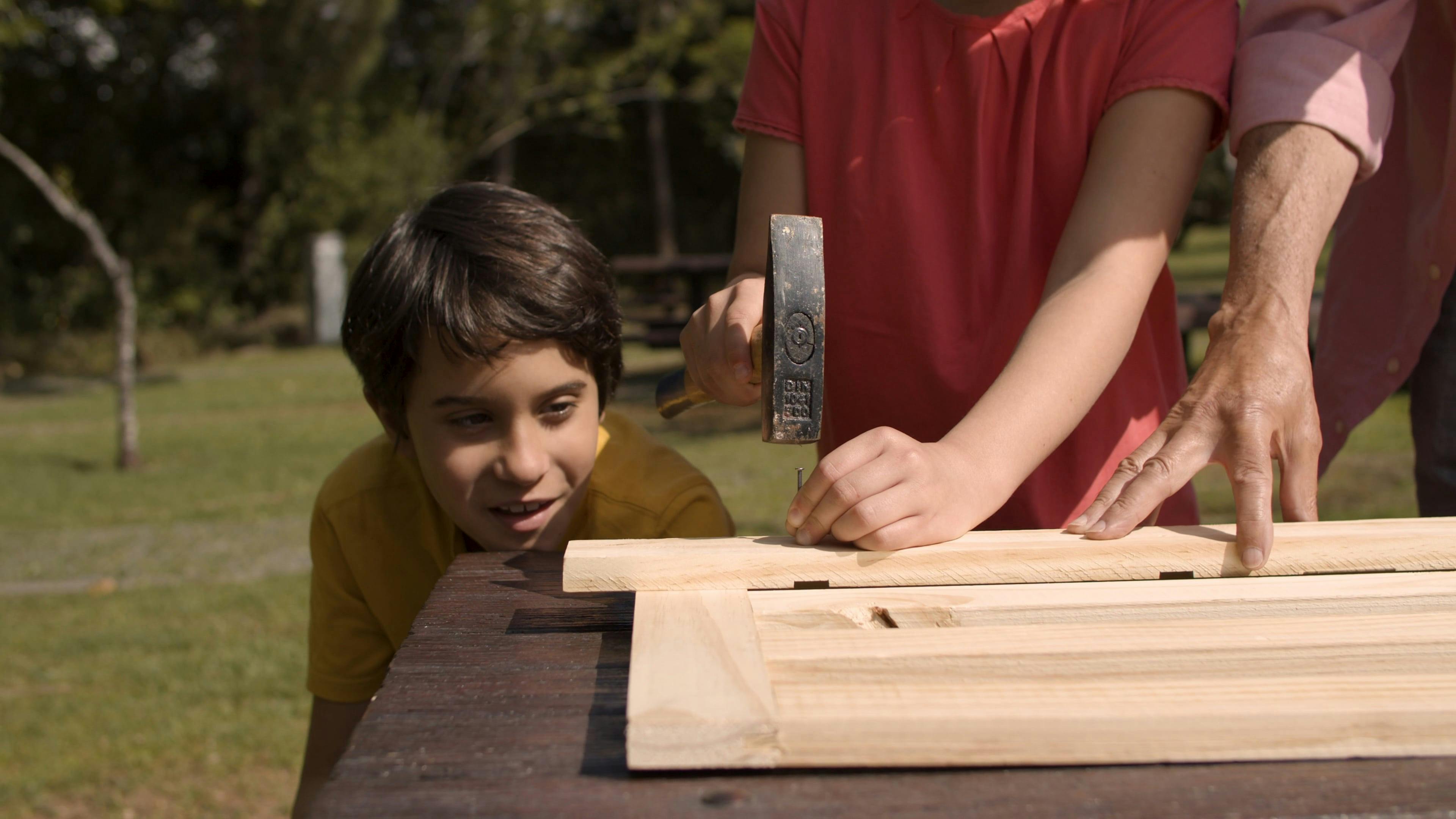 Two Children Learning Carpentry with their Grandfather Free Stock Video ...