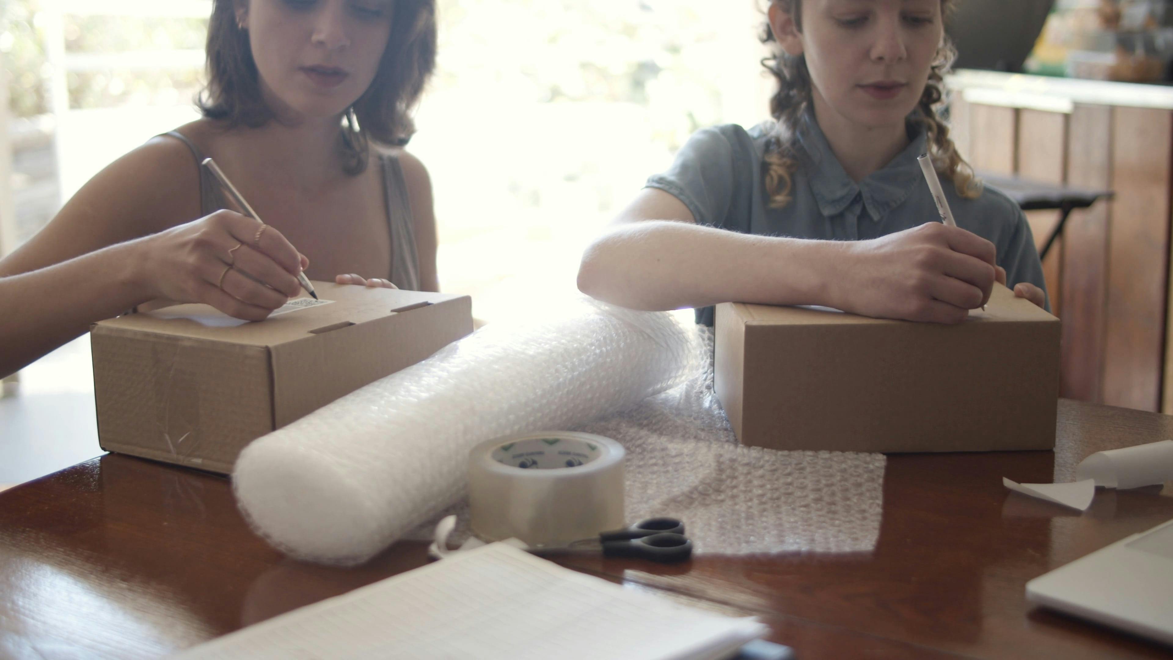 Women Writing on Parcel Boxes Free Stock Video Footage, Royalty-Free 4K ...