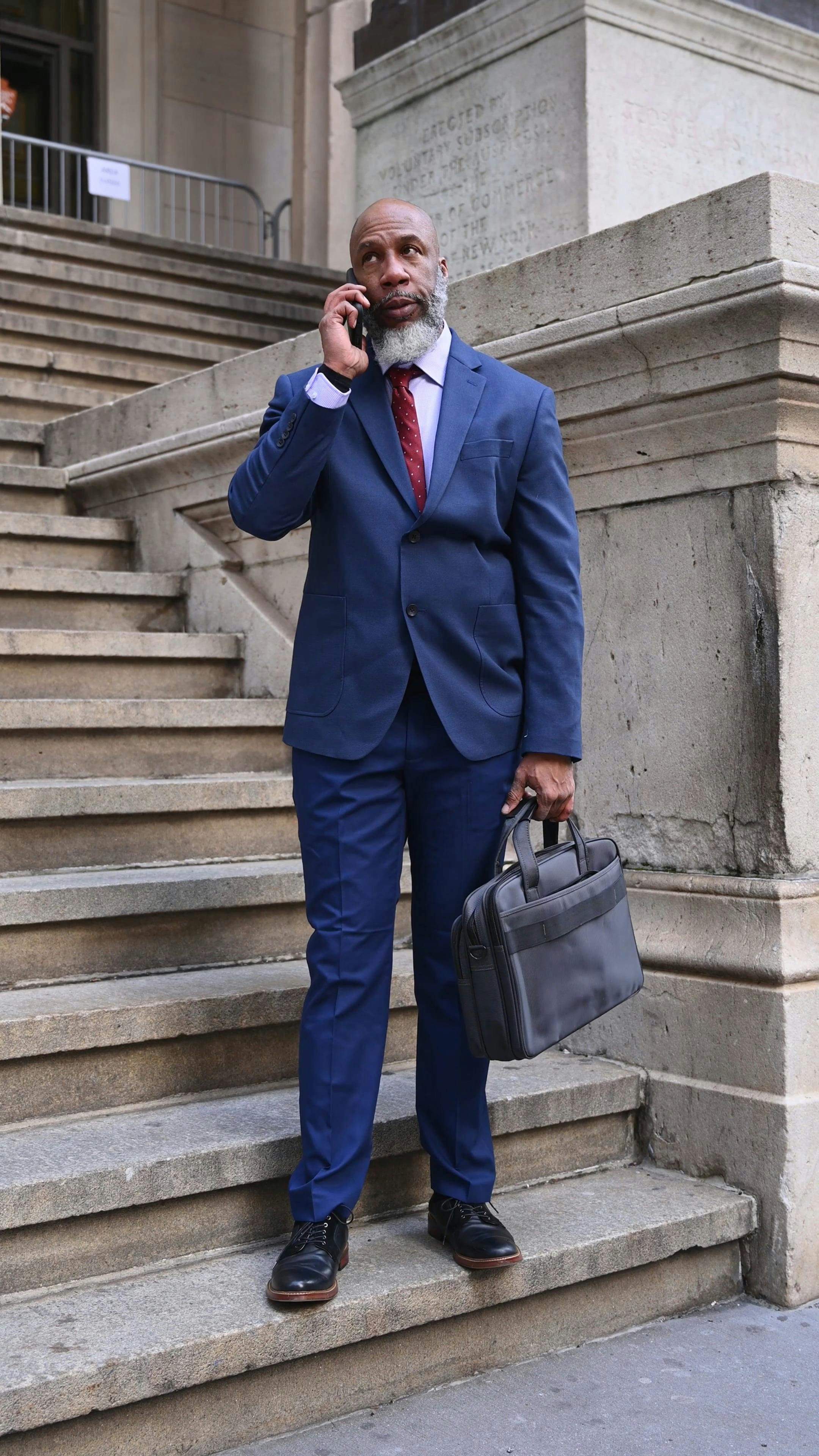 A Businessman Having a Phone Call while Carrying a Briefcase · Free ...