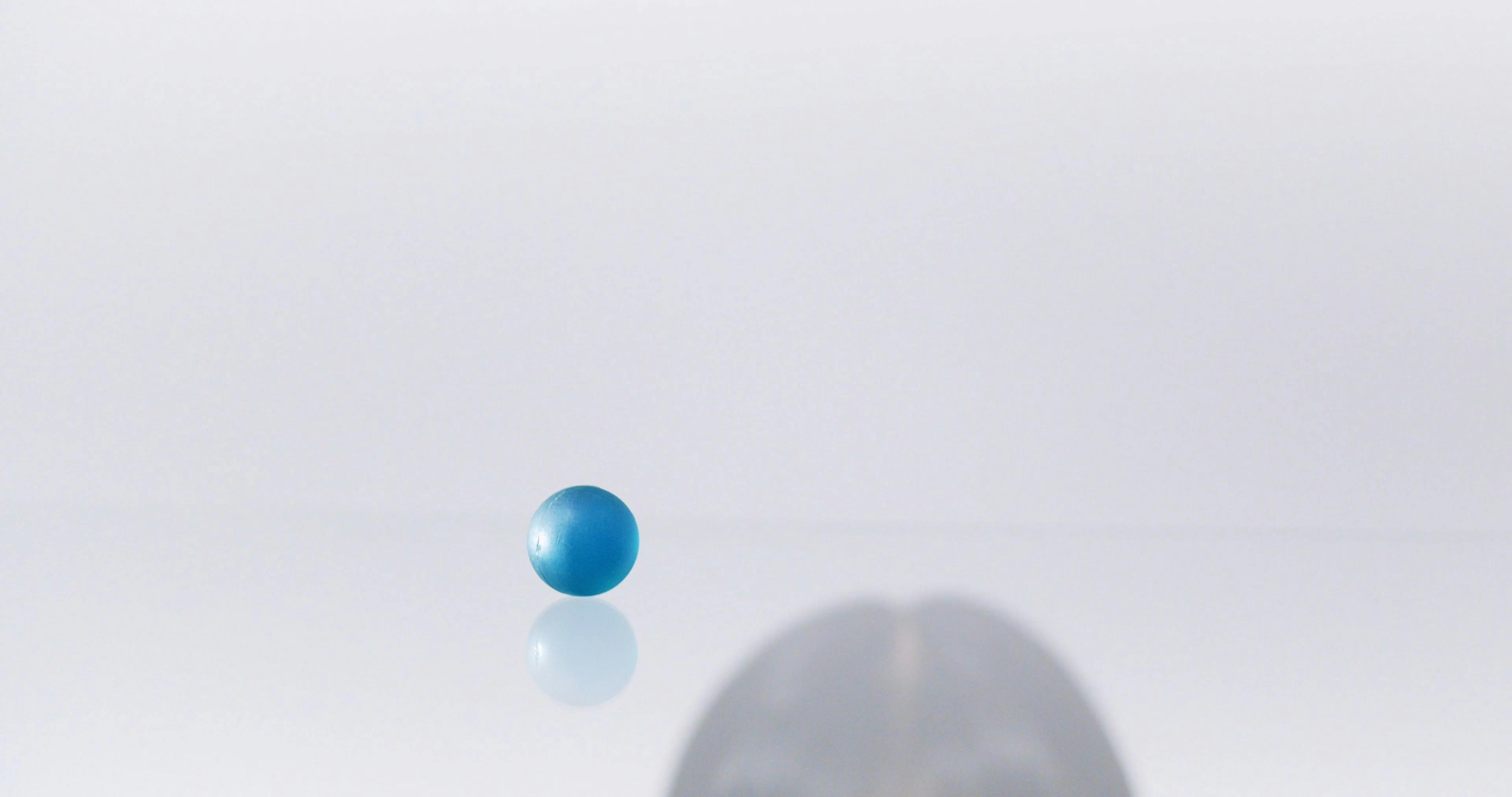 Woman Blowing a Small Blue Ball · Free Stock Video