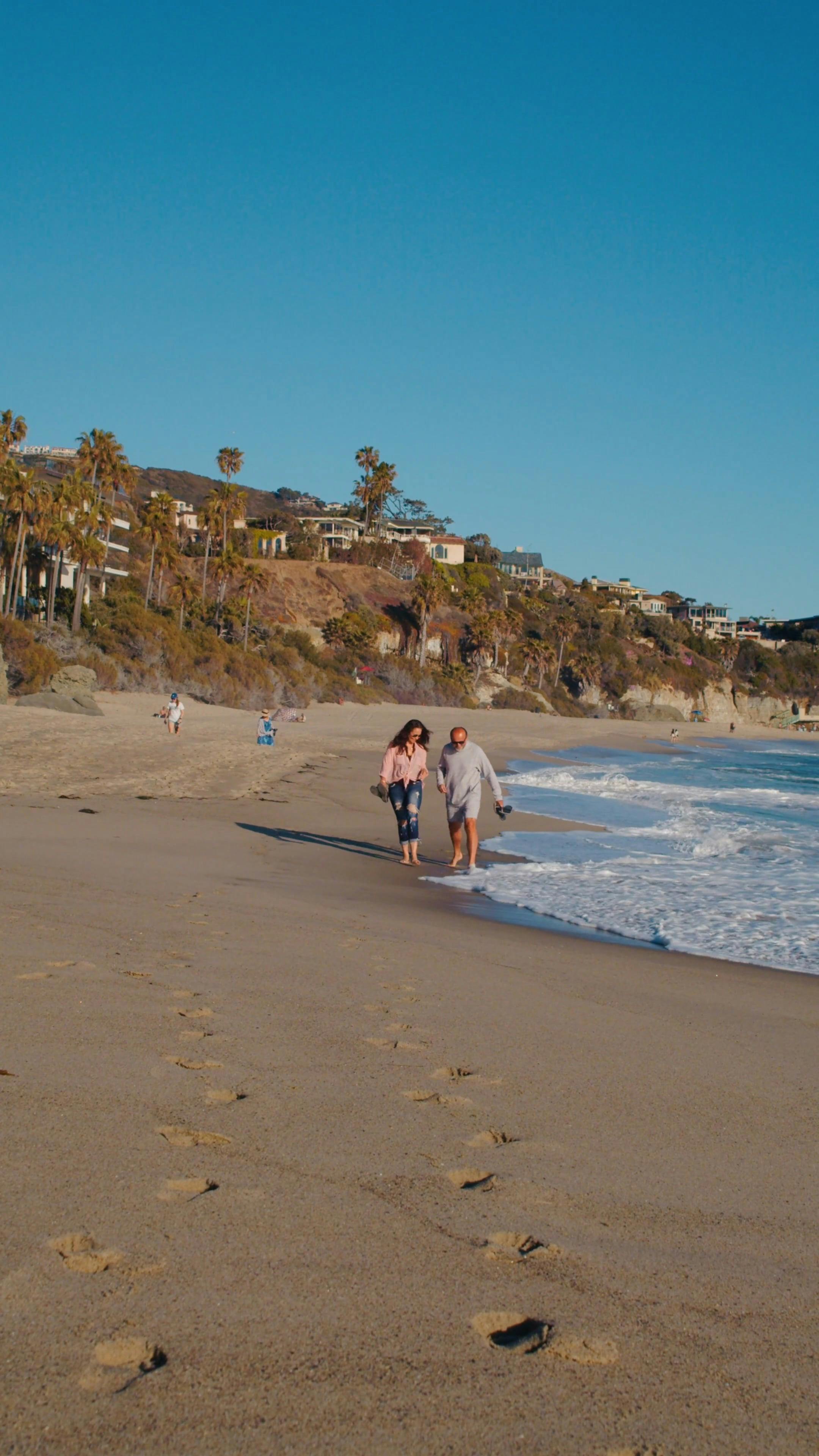 People Walking on the Beach · Free Stock Video