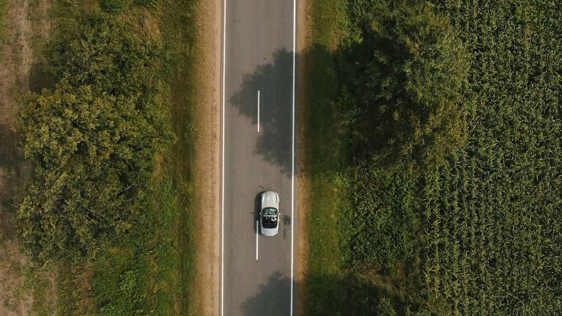 Drone Footage of a Vehicle Traveling on a Countryside Road Free Stock ...