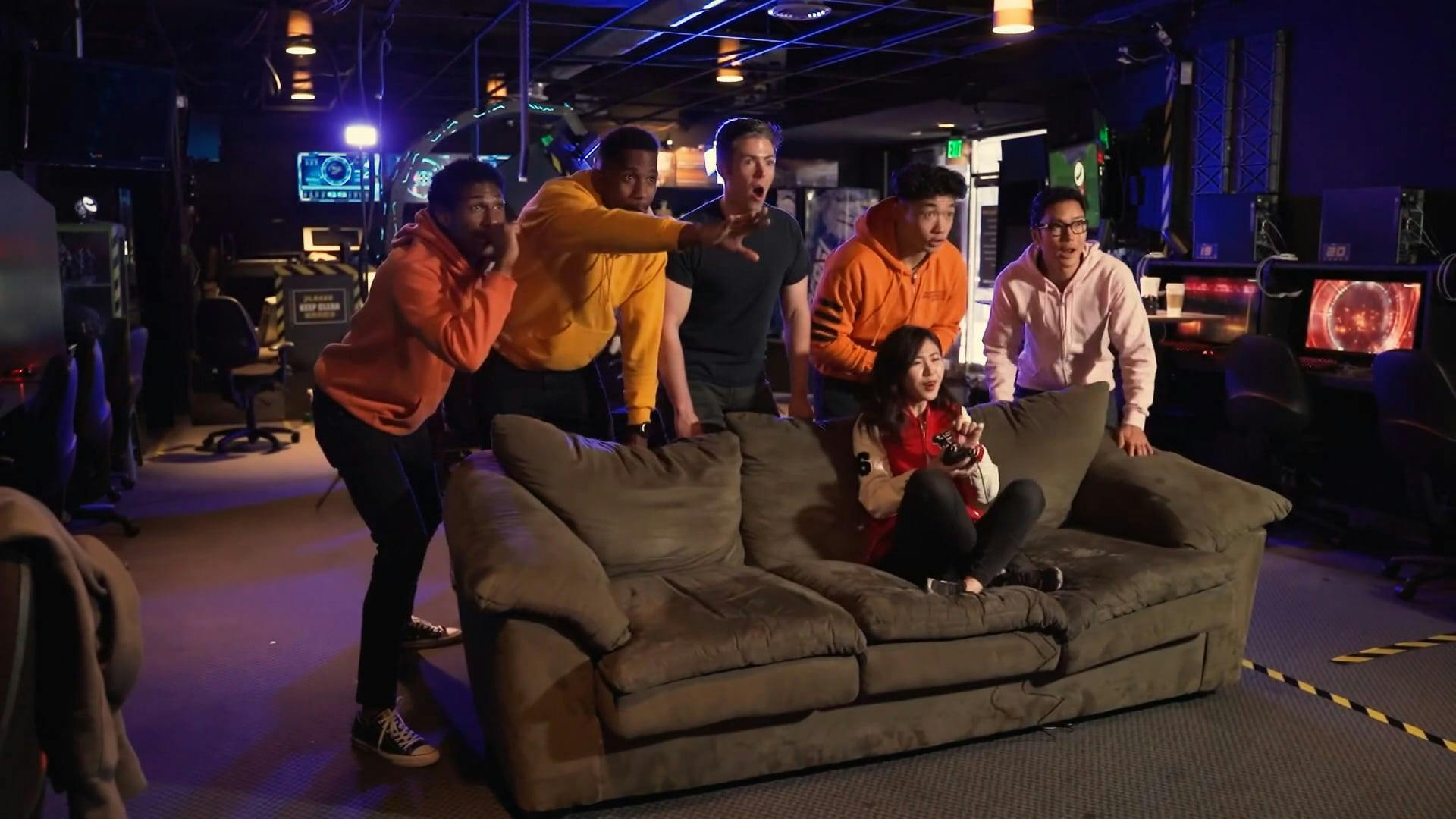 Men Cheering for a Woman Playing Video Games · Free Stock Video