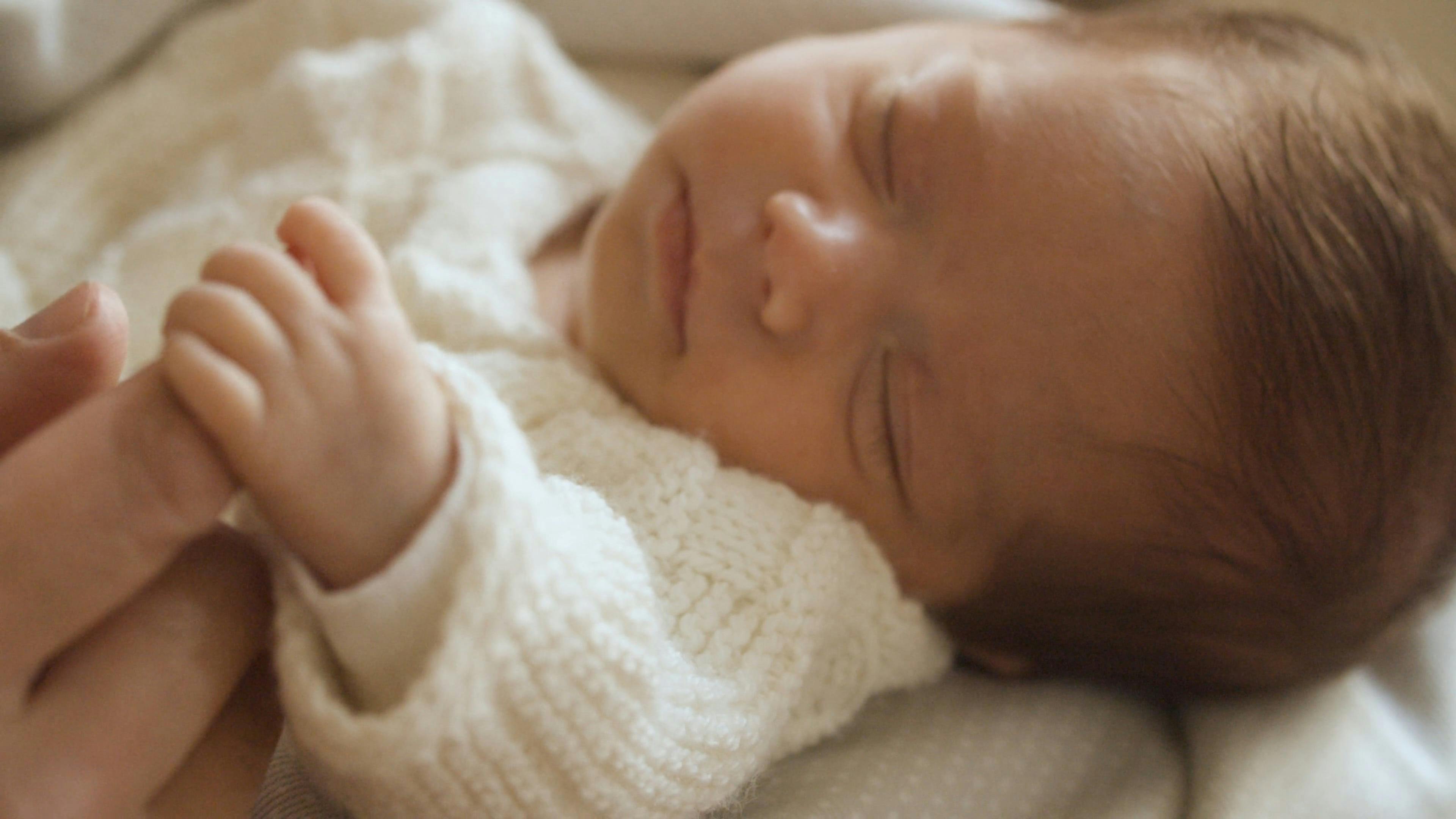 Close Up Video of a Newborn Baby Holding a Finger · Free Stock Video