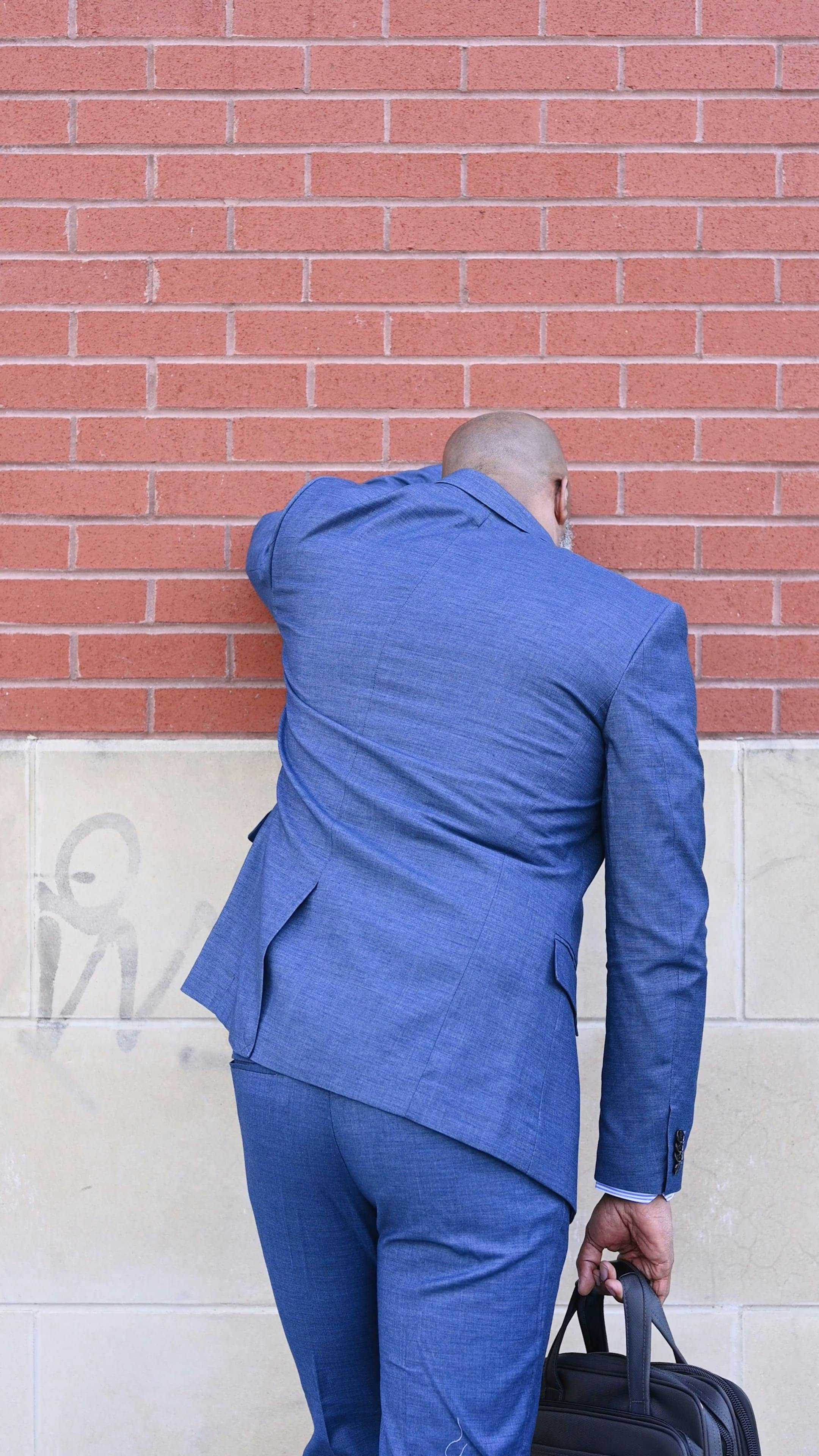 Man Leaning Against the Wall · Free Stock Video