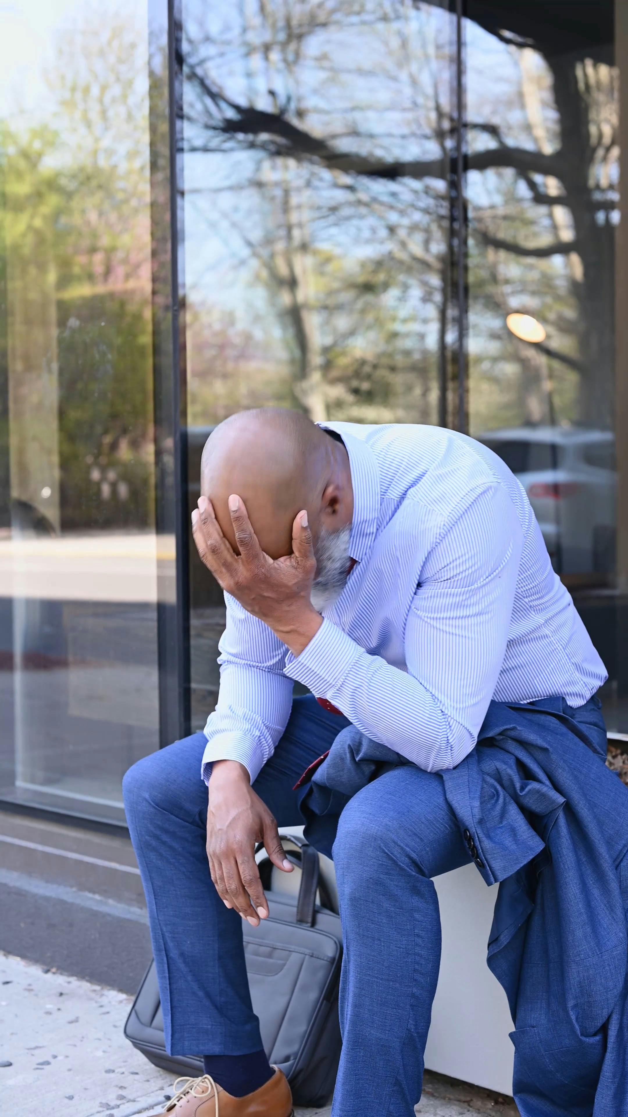 Disappointed Man Sitting on Plant Box · Free Stock Video