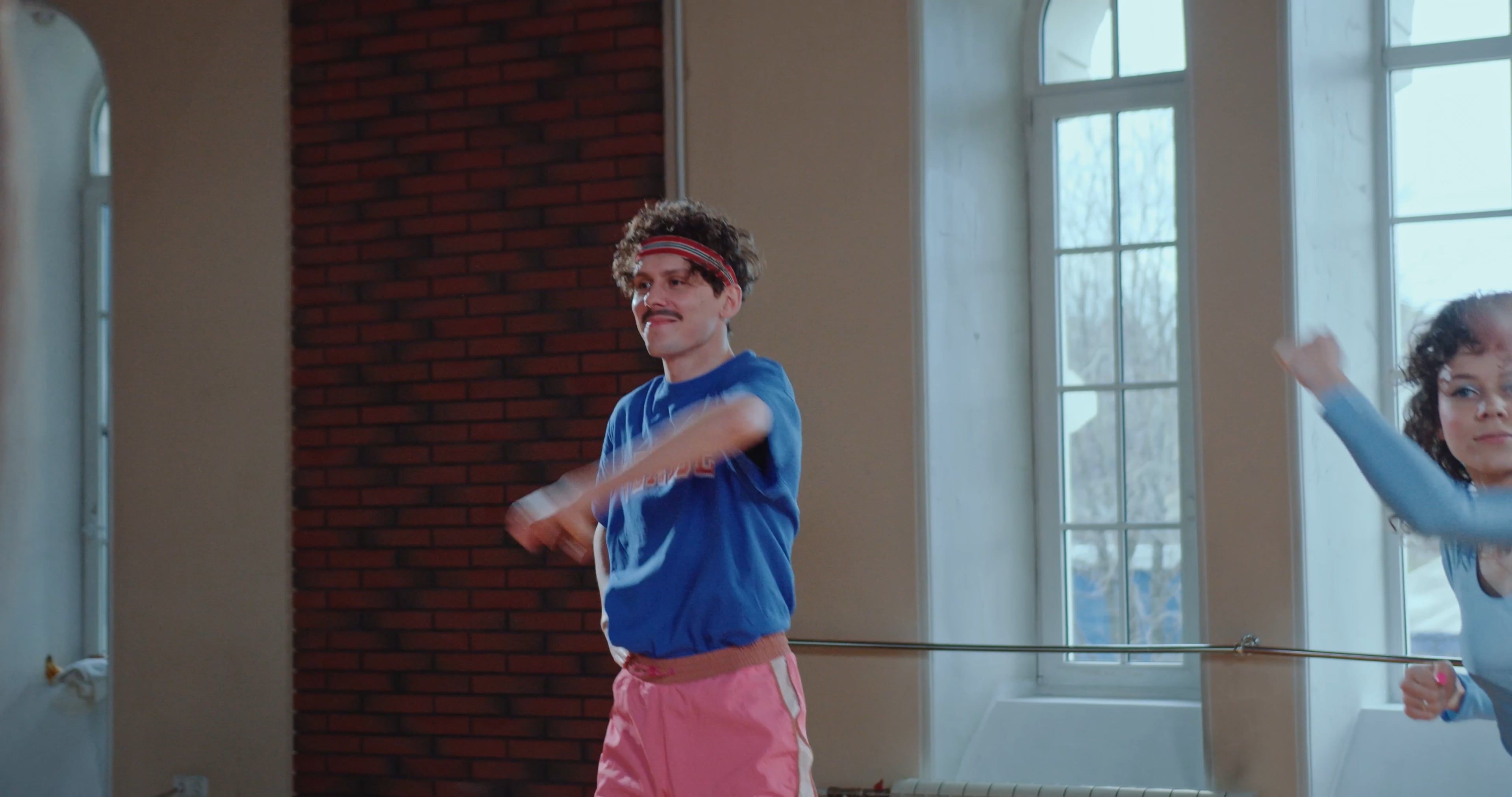 A Man in a Retro Outfit Exercising at an Aerobics Class Free Stock ...