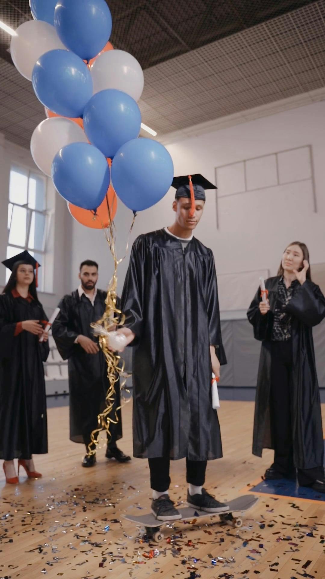 Male Graduate Standing on her Skateboard Free Stock Video Footage ...