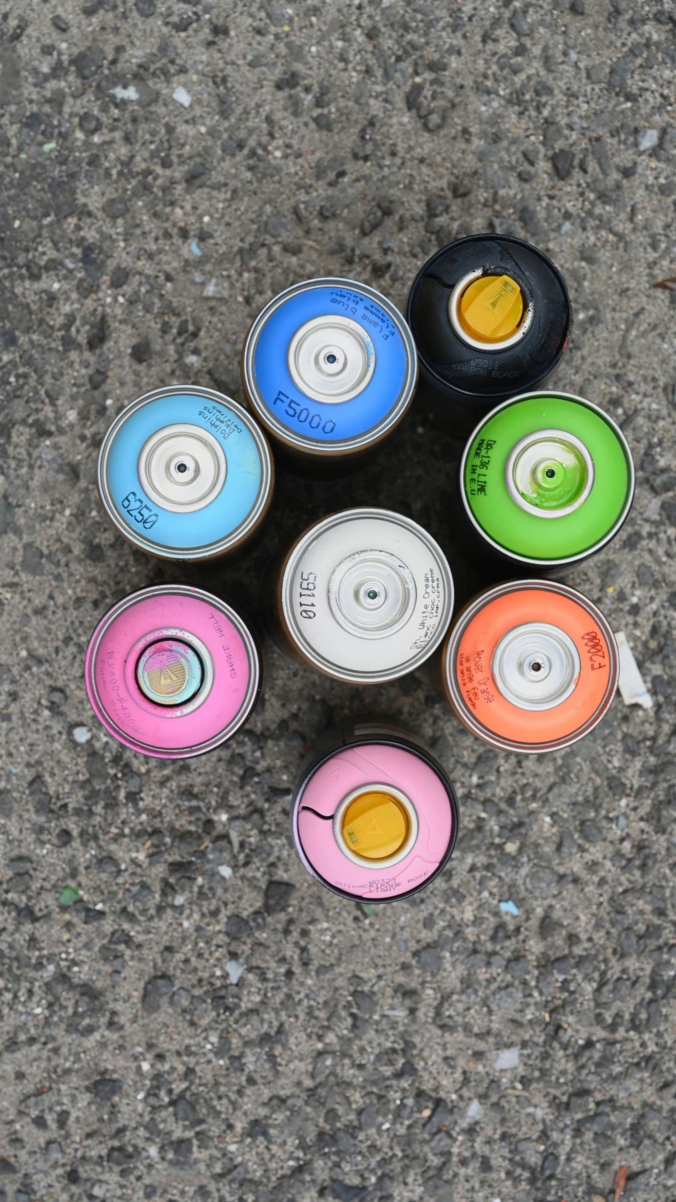 An Overhead Shot of Spray Cans · Free Stock Video