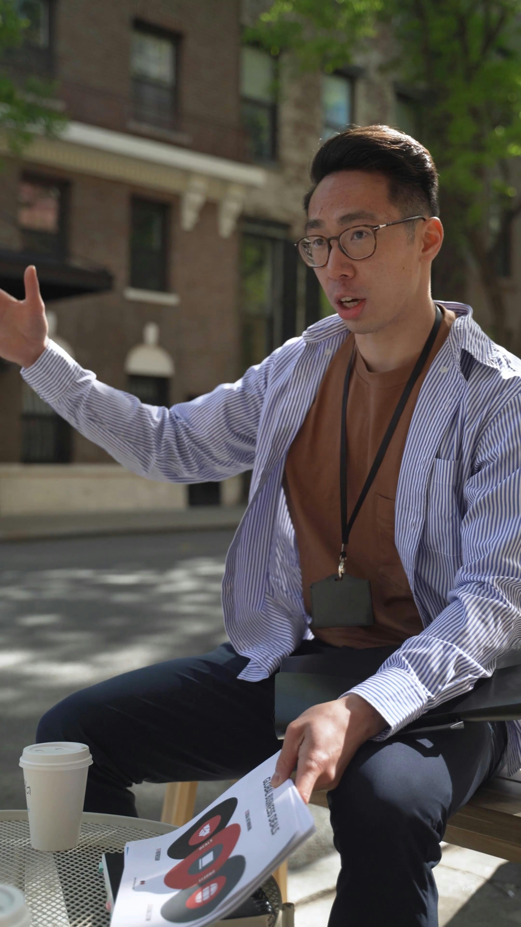 Young Adult Man Showing Paperwork Outdoors · Free Stock Video