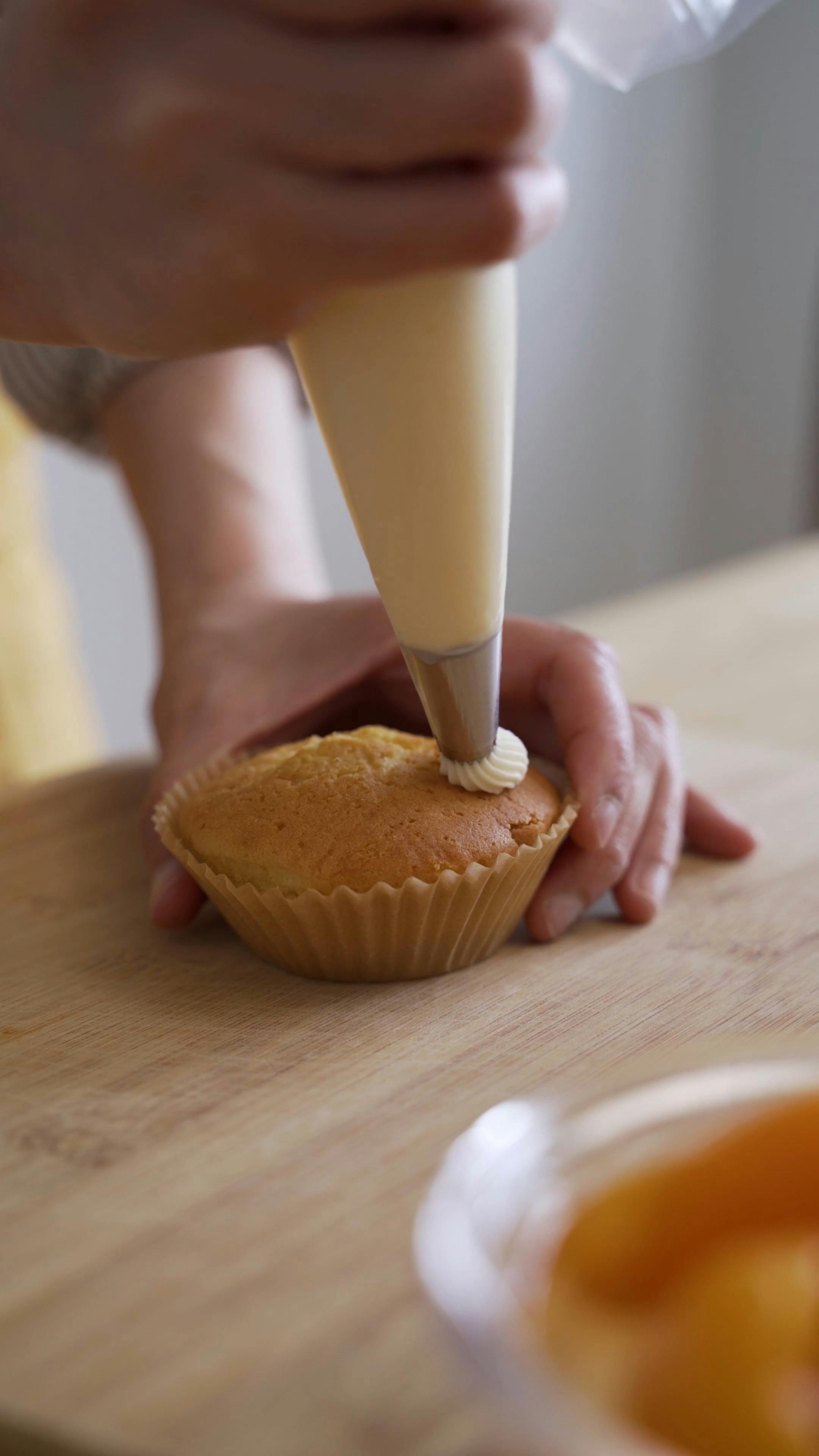 A Person Putting Icing on Top of a Cupcake Free Stock Video Footage ...