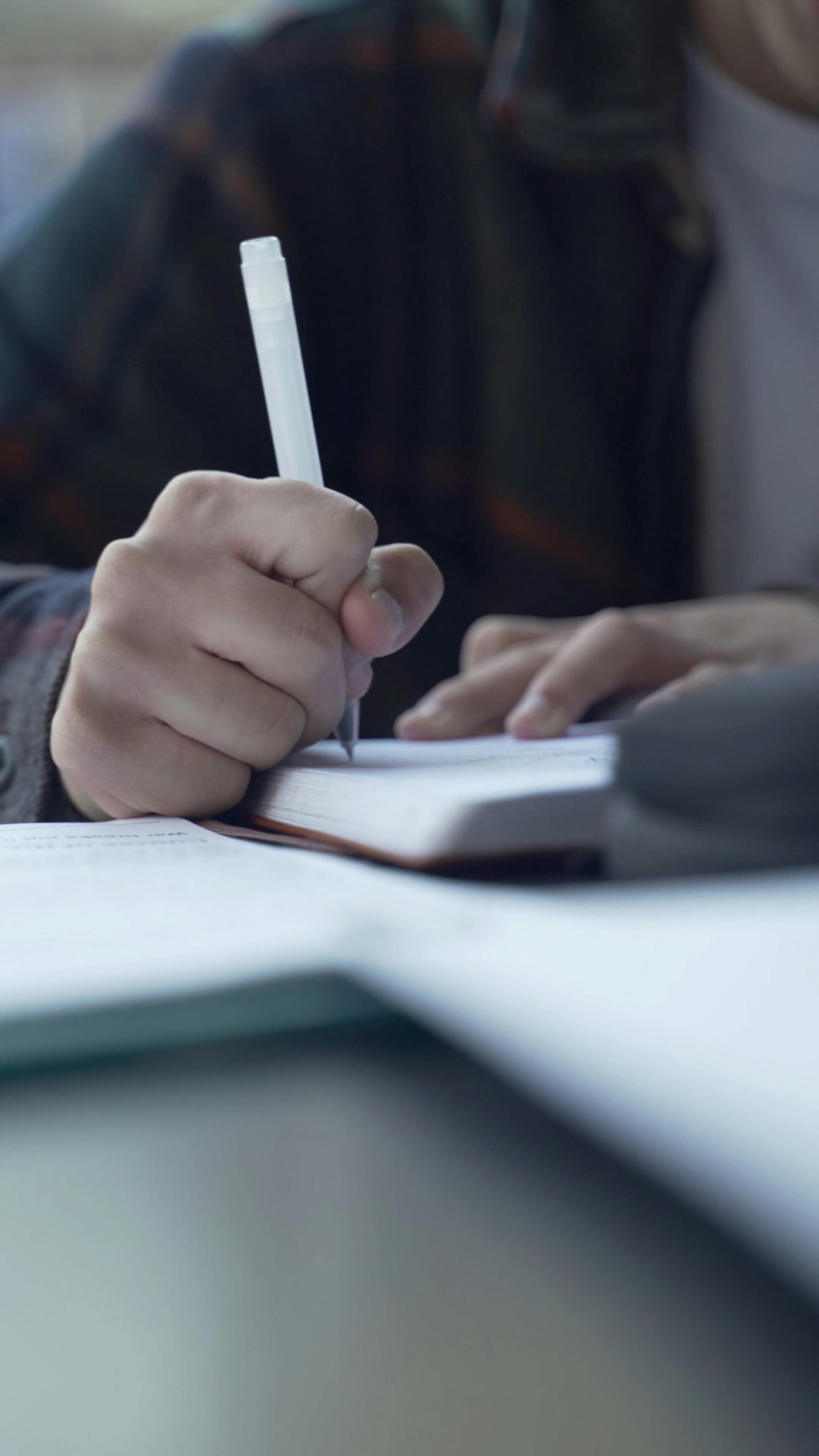 A Person is Writing · Free Stock Video