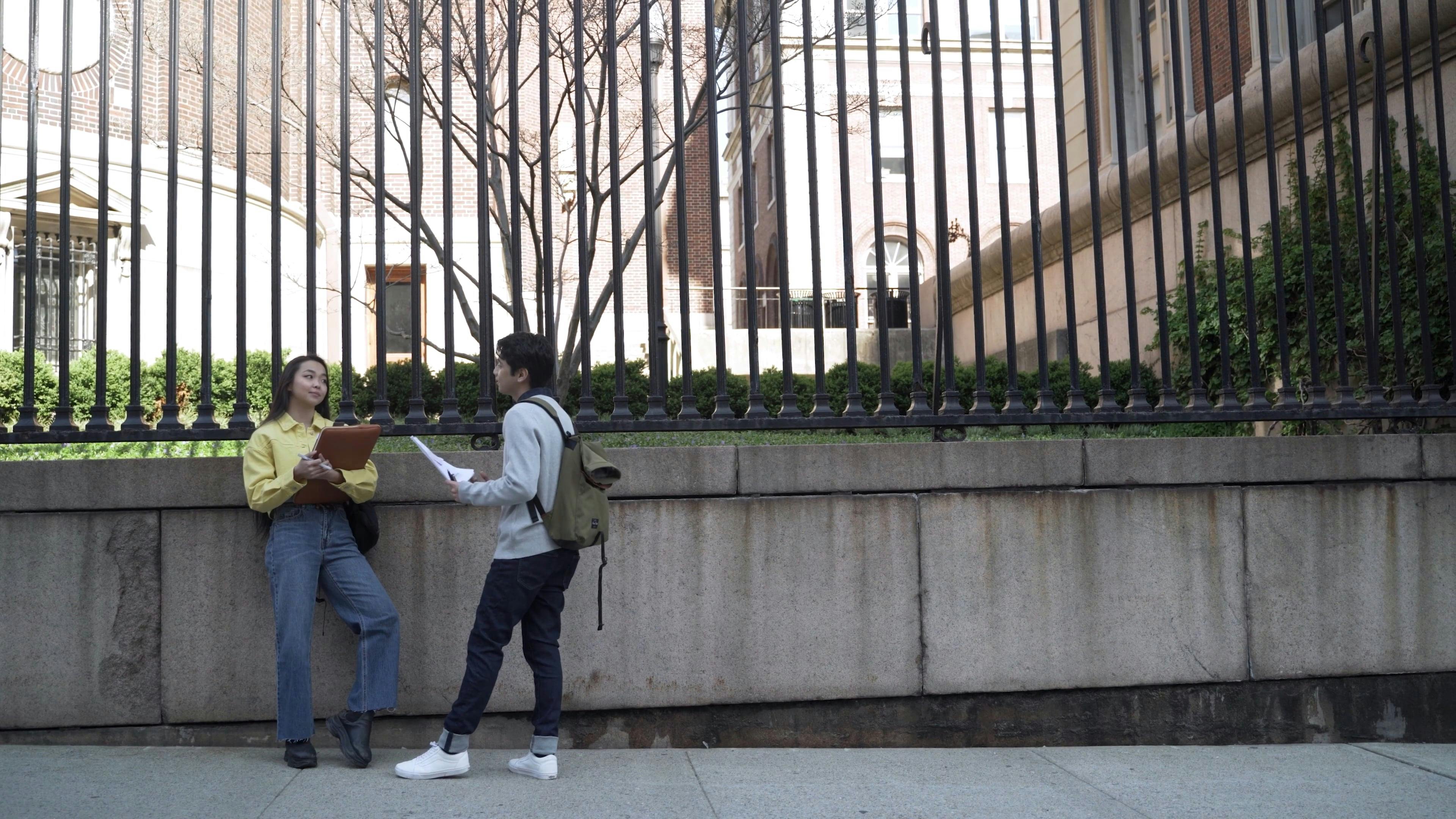 Man and Woman Talking Outside the Campus · Free Stock Video