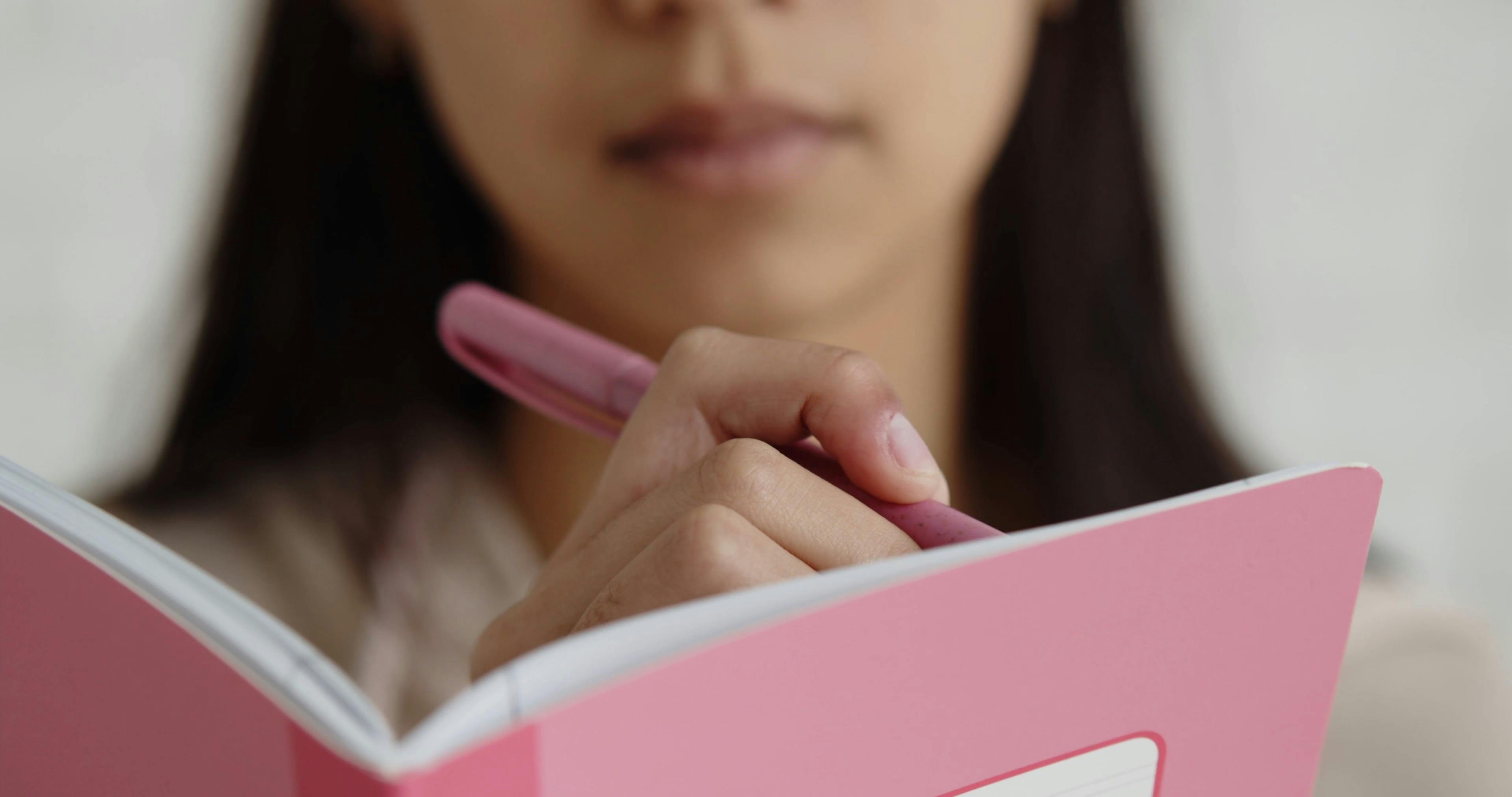 Girl Writing on her Notebook Free Stock Video Footage, Royalty-Free 4K ...