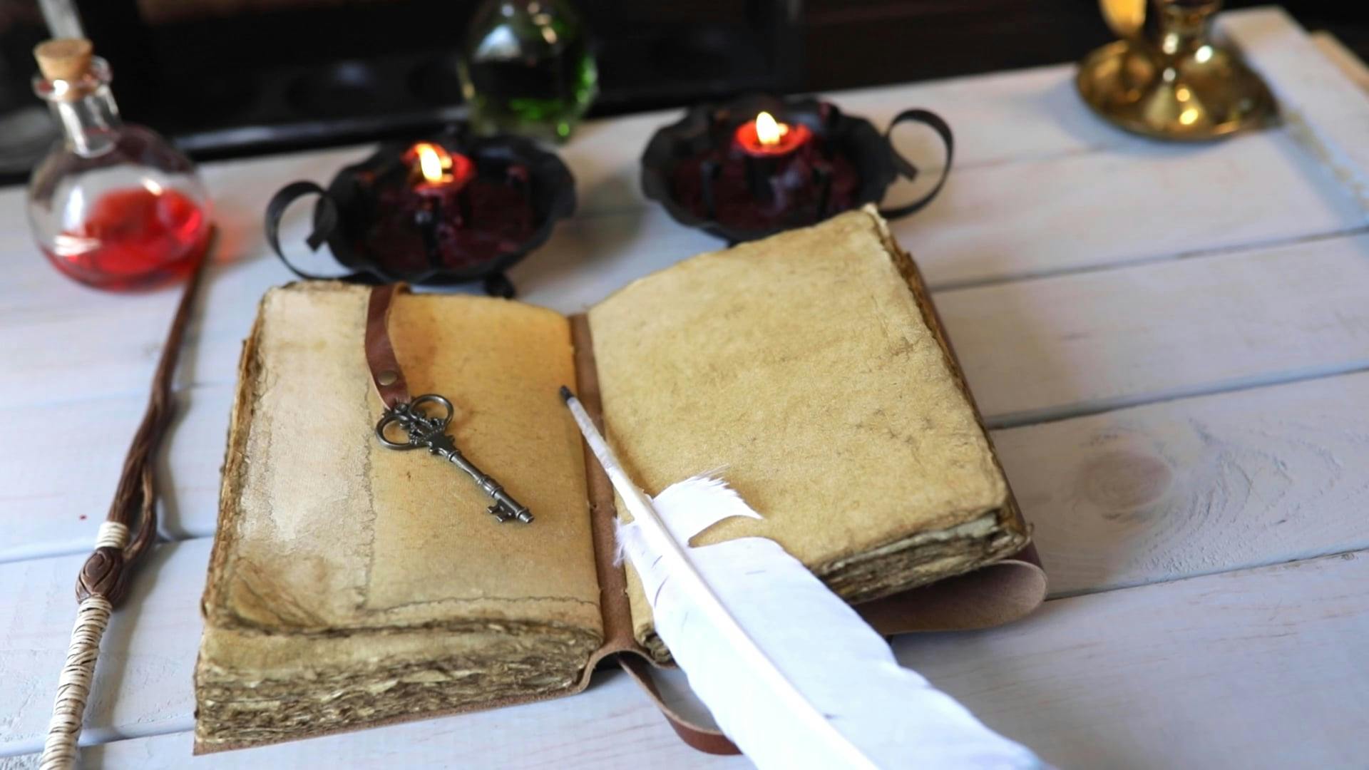 A Book, Quill, Key and a Wand on a Table · Free Stock Video