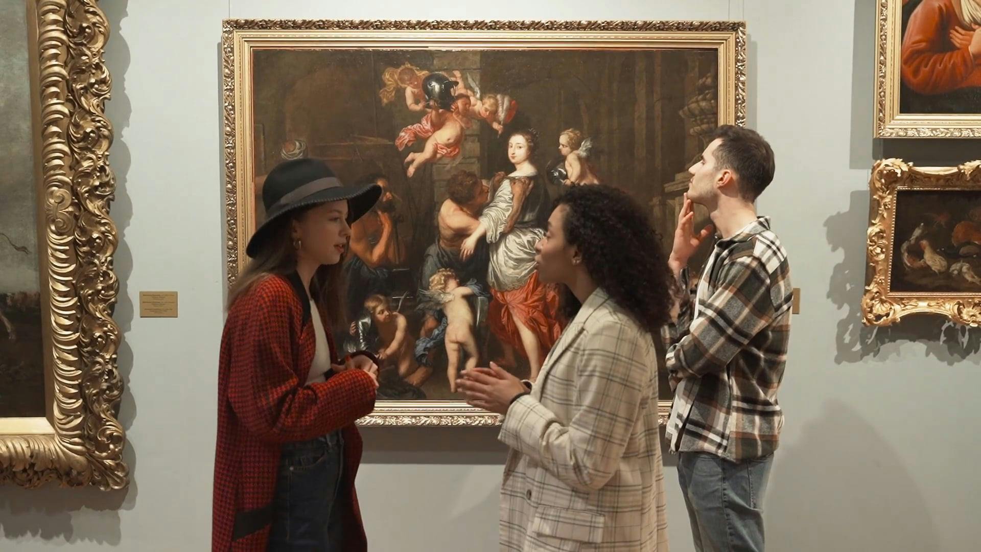 A Man and Women Talking About Painting · Free Stock Video