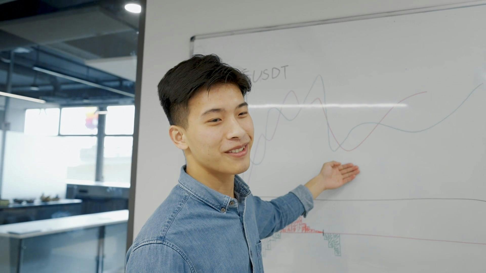 A Man Talking while Pointing at a Whiteboard · Free Stock Video
