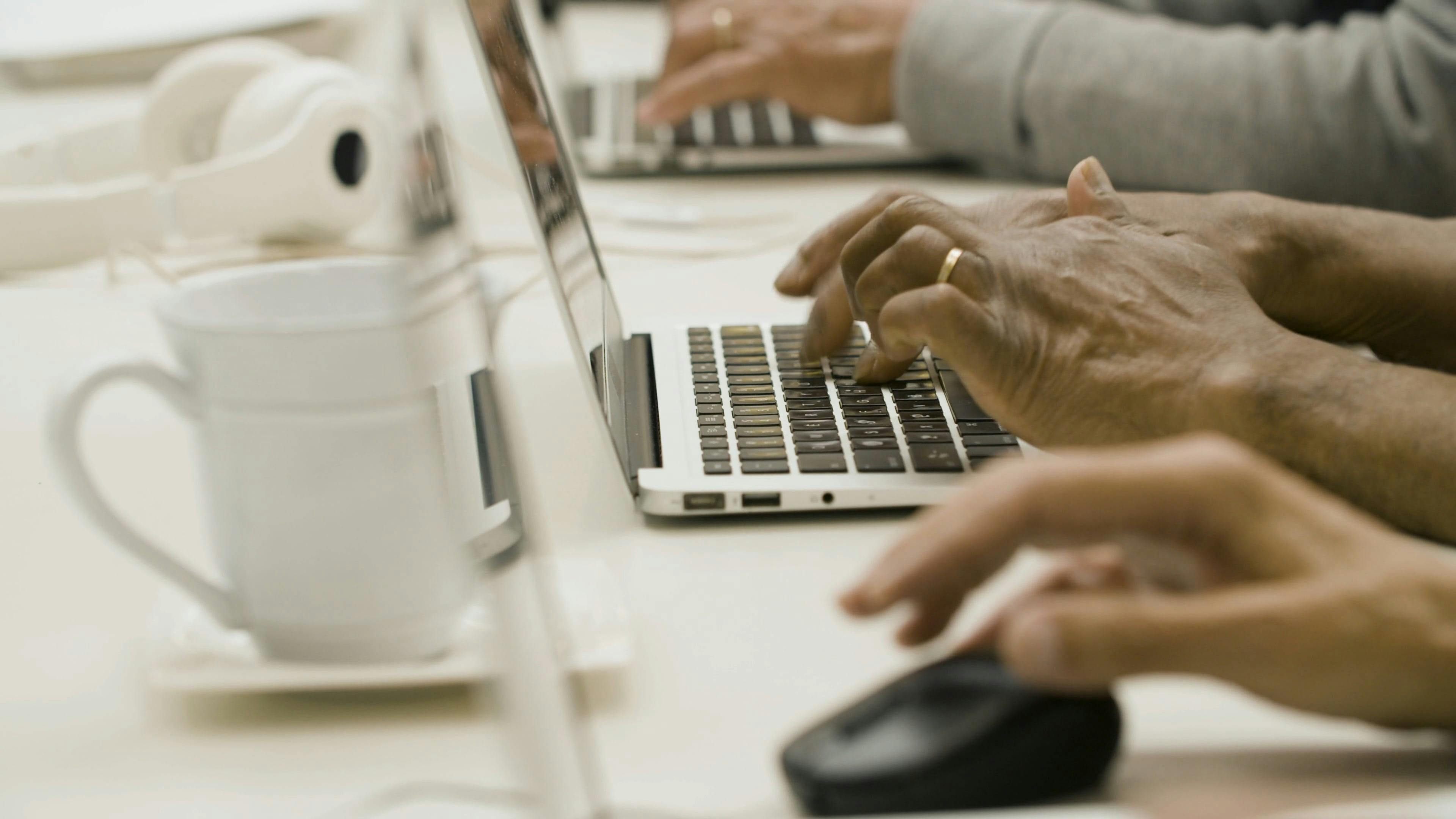 Close Up Video of People Typing on a Laptops · Free Stock Video